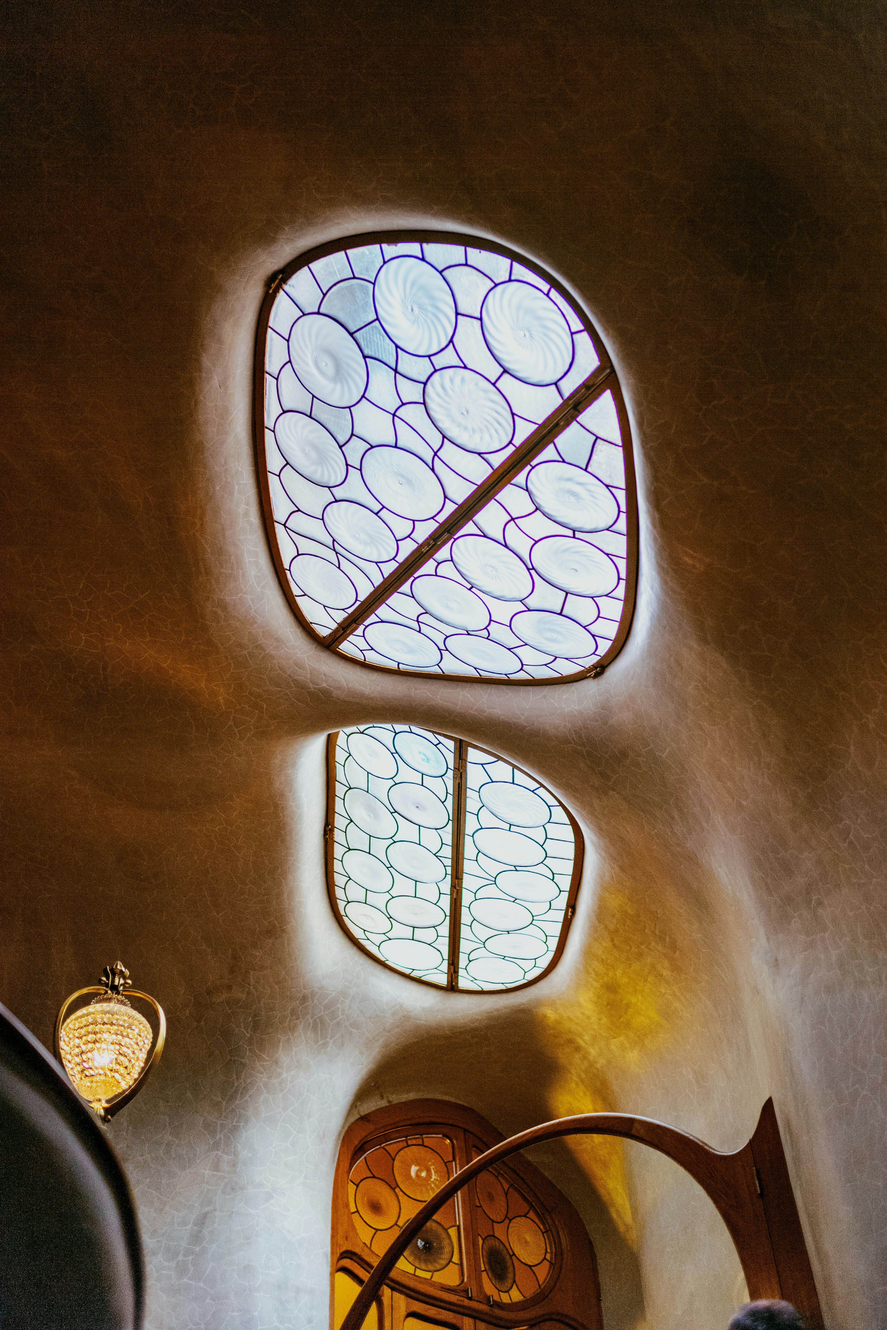 Stained Glass Light and Organic Architecture in a Wavy Interior