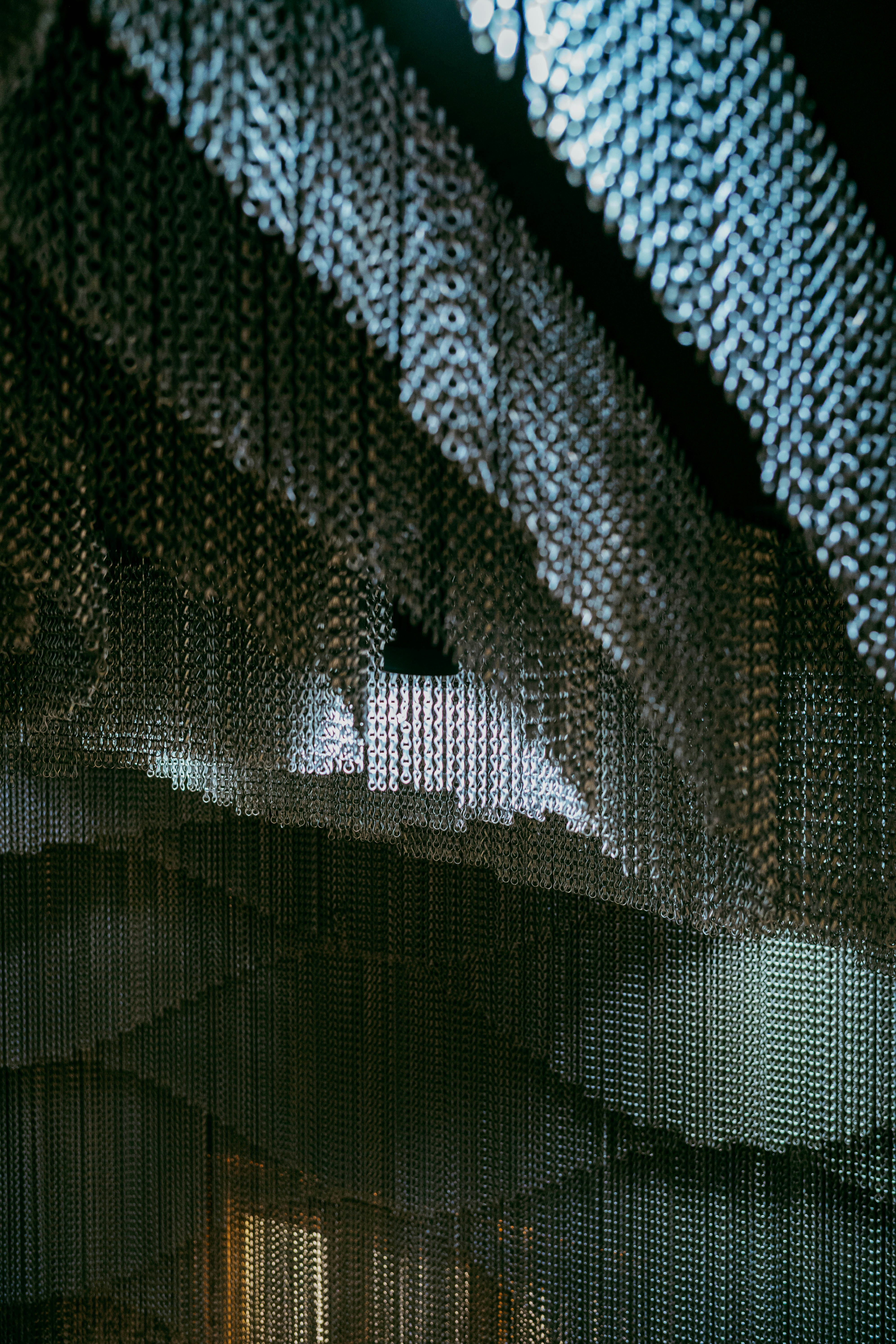 Overlapping Metallic Ridges: An Abstract Architecture of Light and Shadow