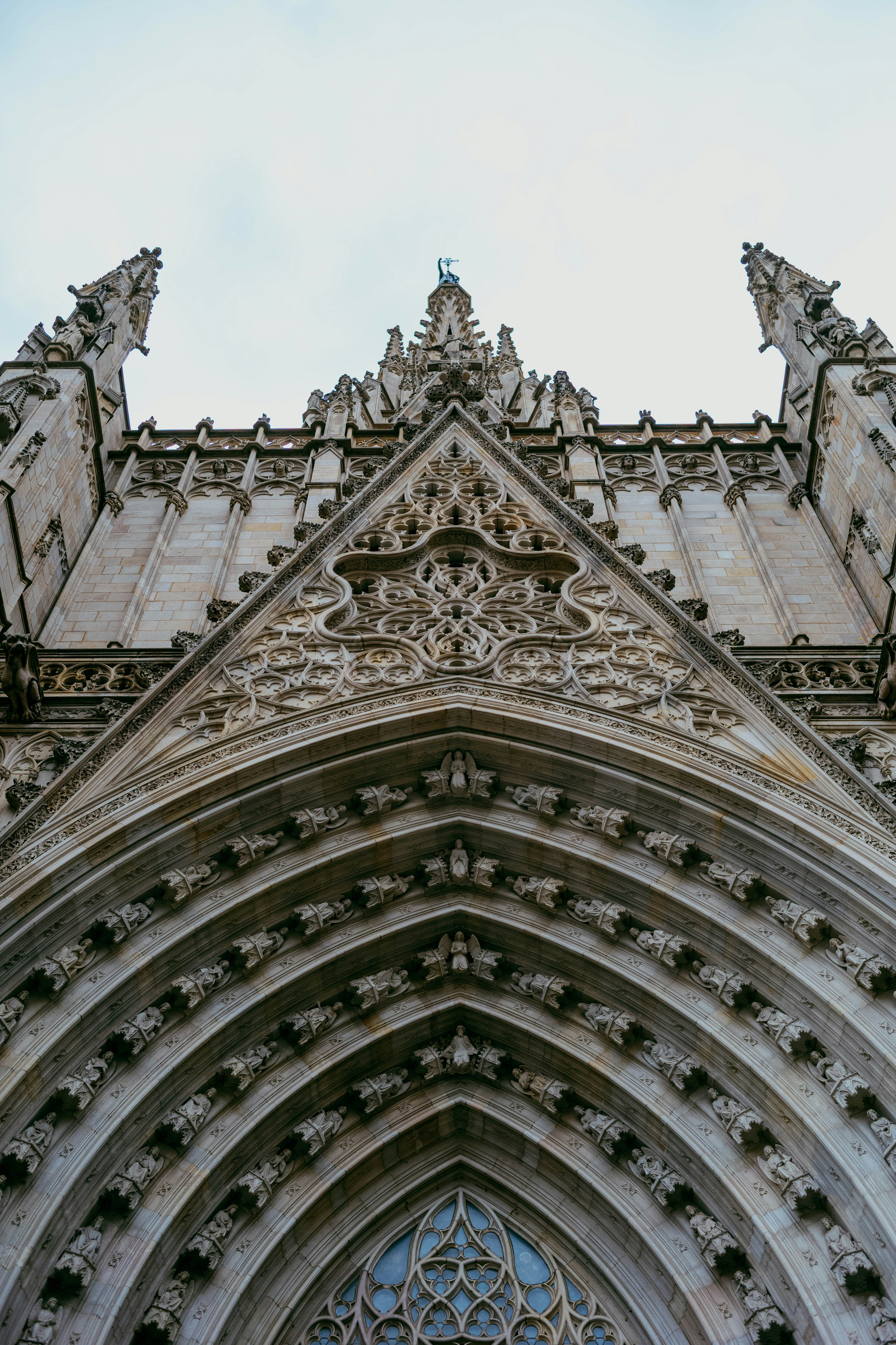 Gothic Cathedral Facade: Ornate Archways Ascend toward the Sky