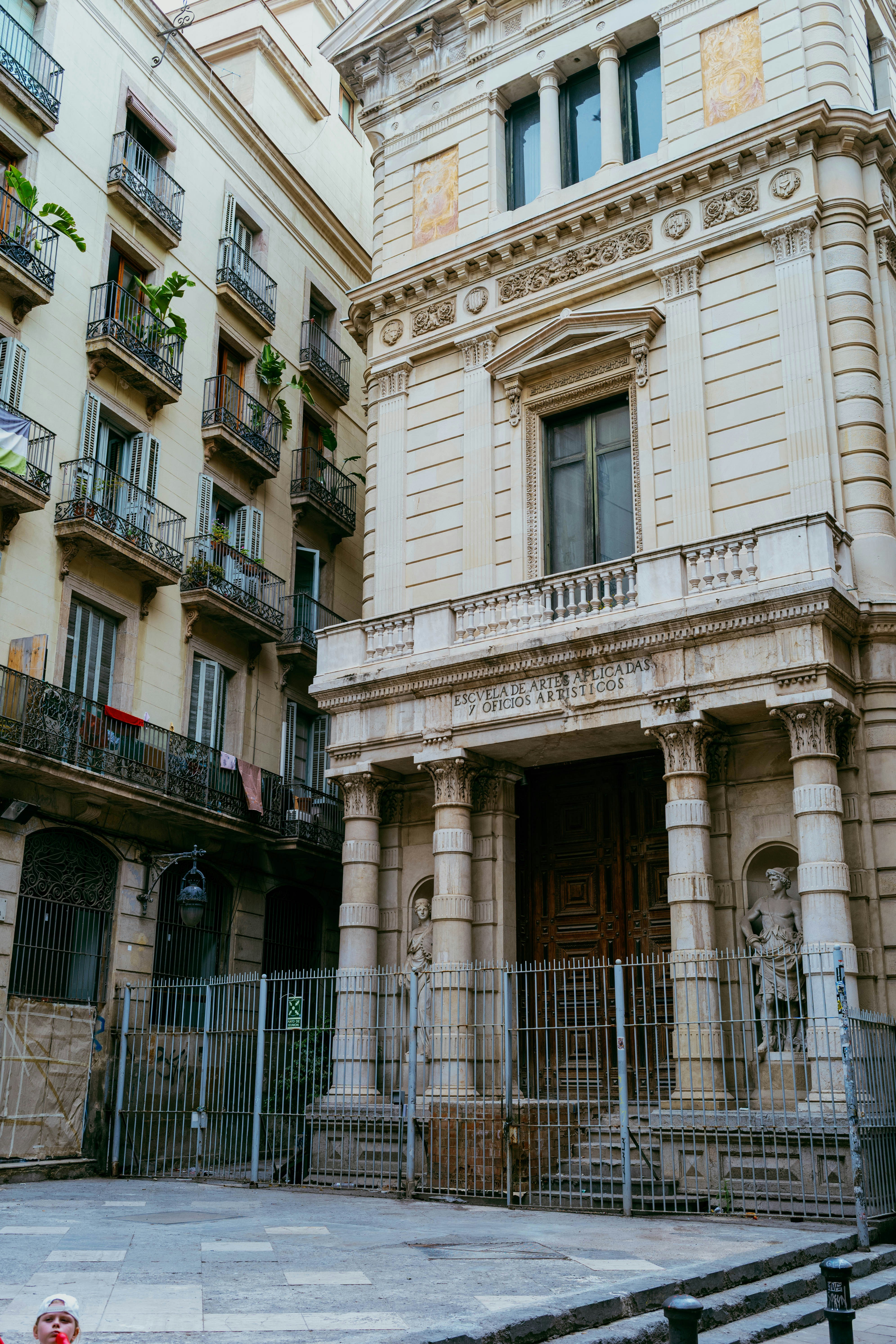 Ornate doorway of a European façade framed by surrounding apartments