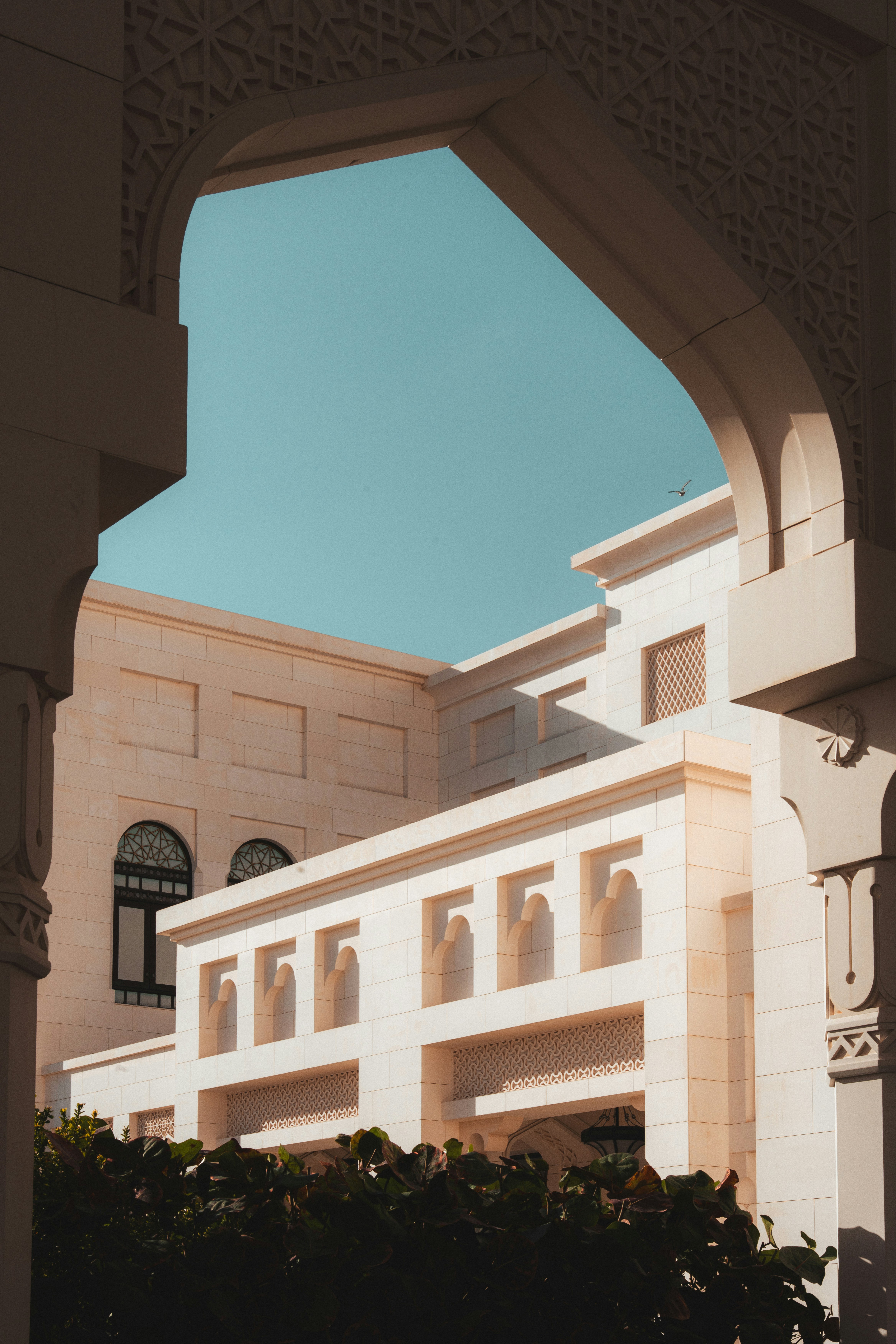 Arched Entrance Framing Light: A Sunlit Architecture Study