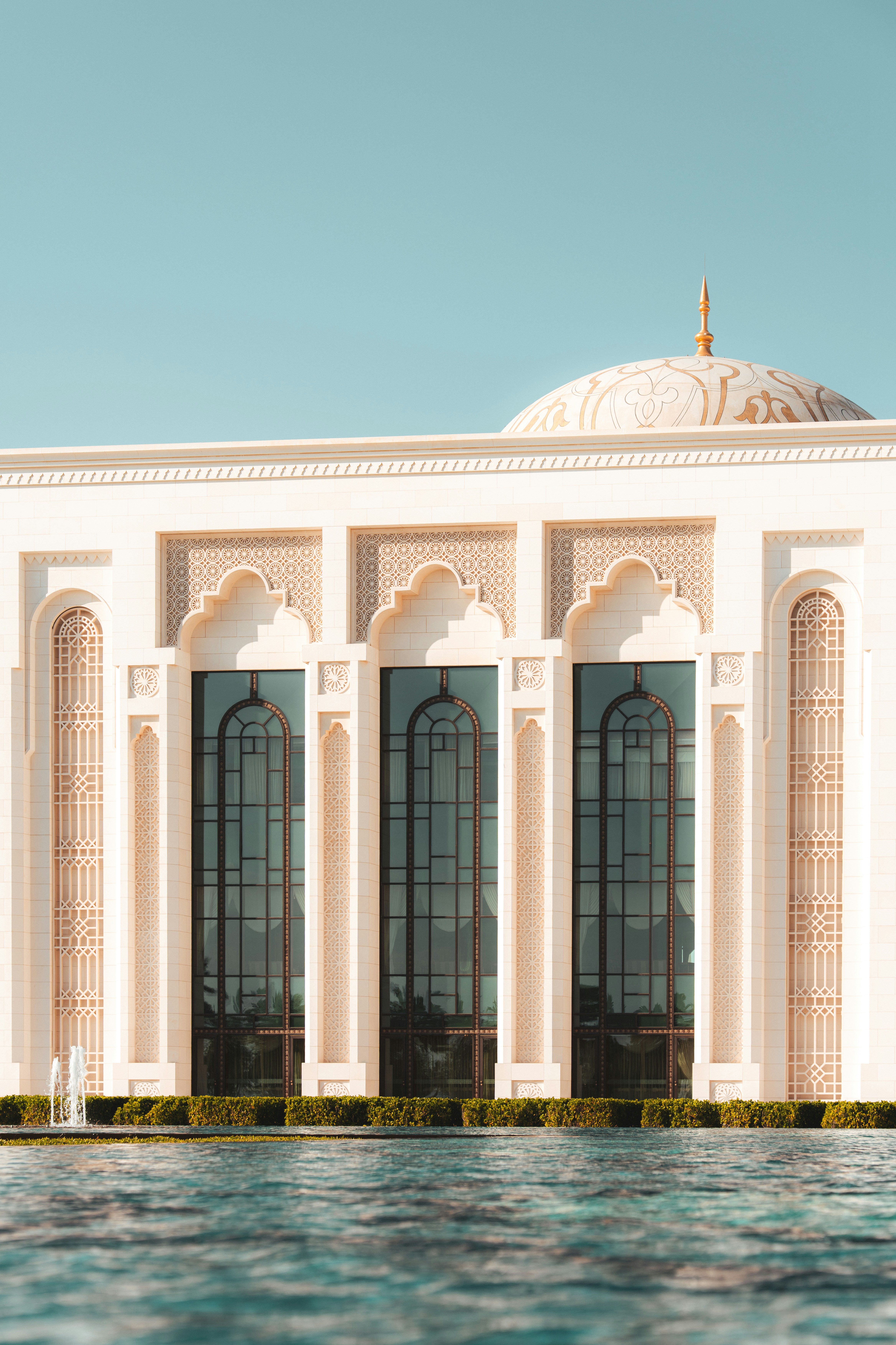A Moorish Facade Framed by a Tranquil Reflective Pool