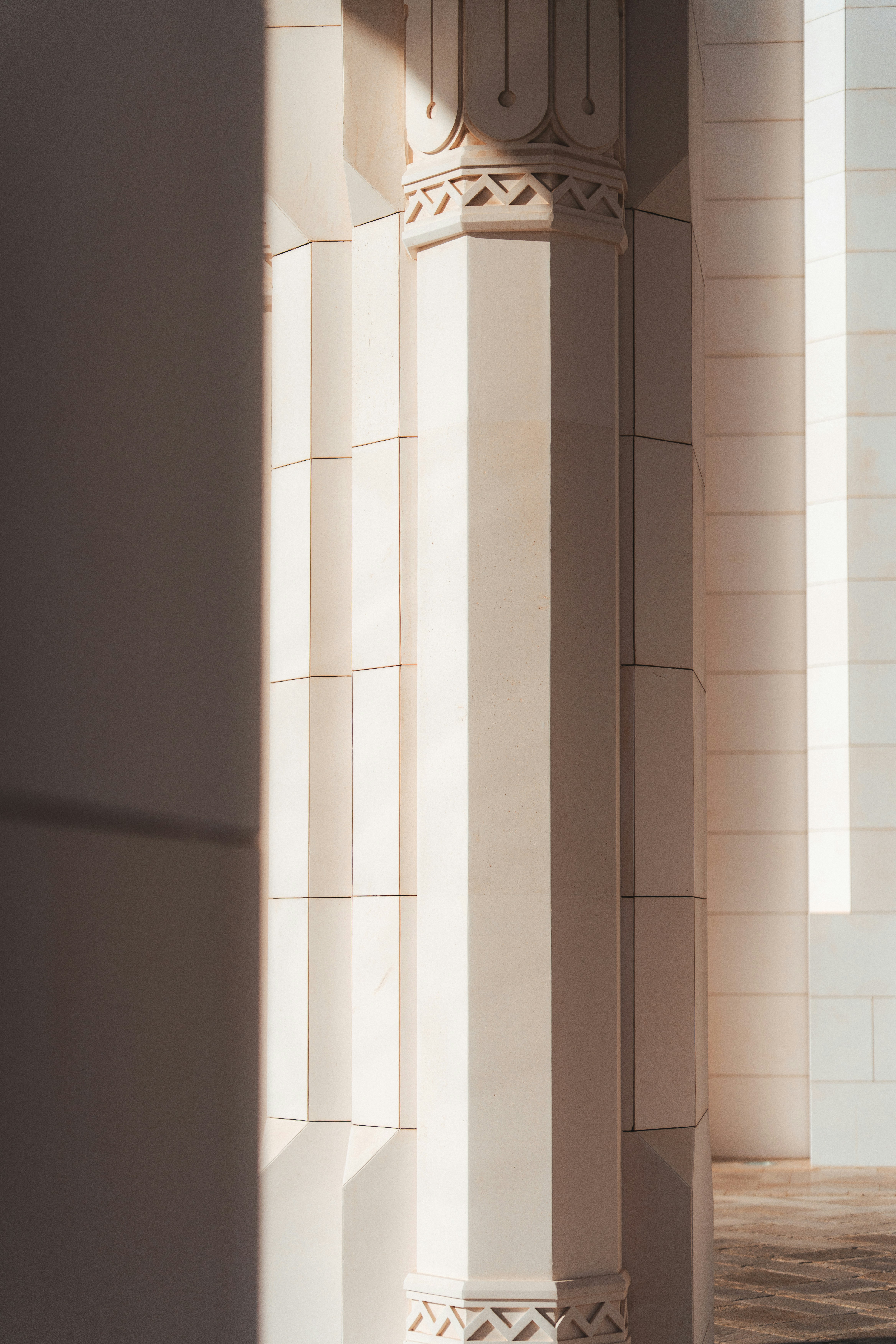 Sunlit Columns: Geometry of Light in Beige Stone