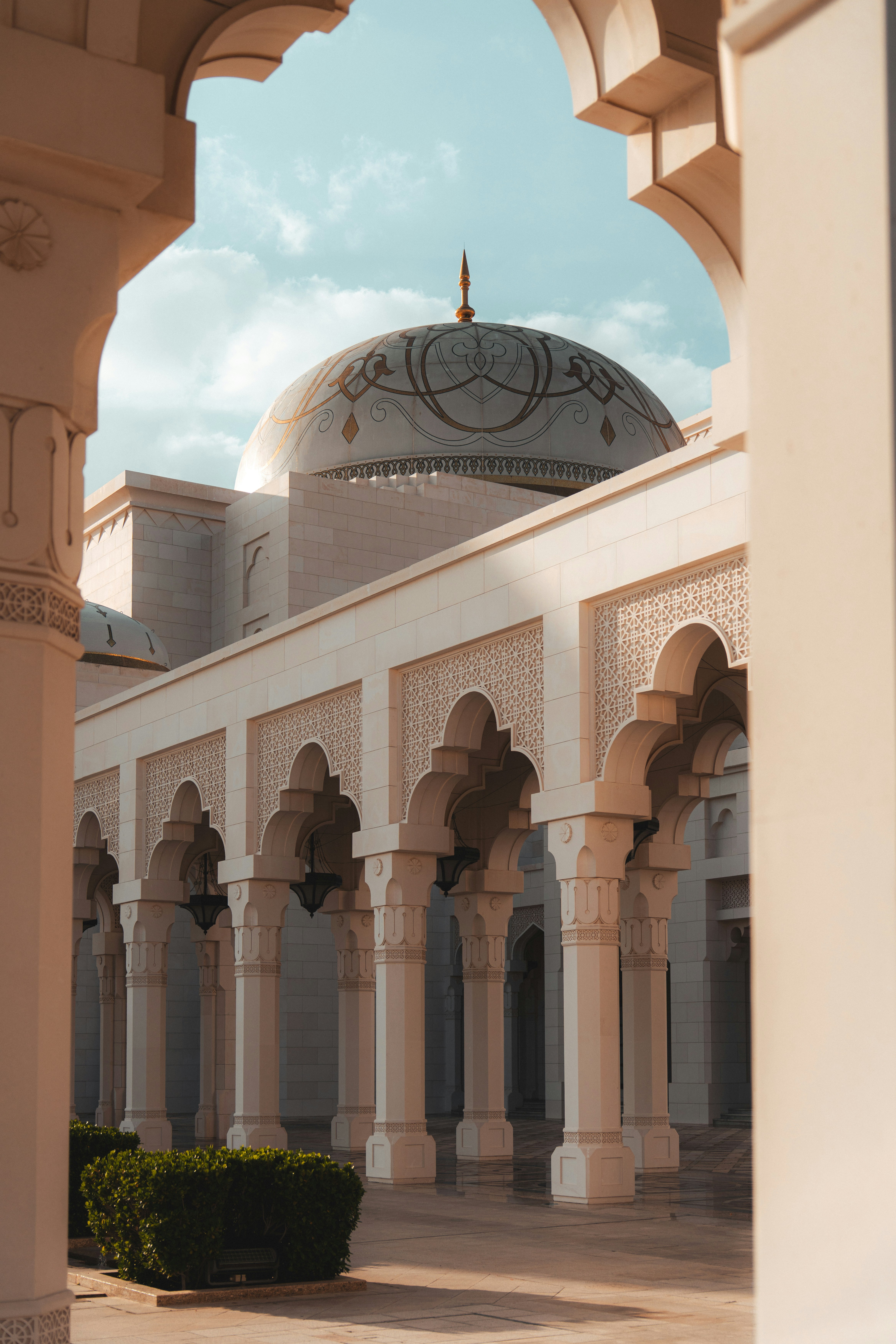 Dome and Arches of a Sunlit Islamic Courtyard