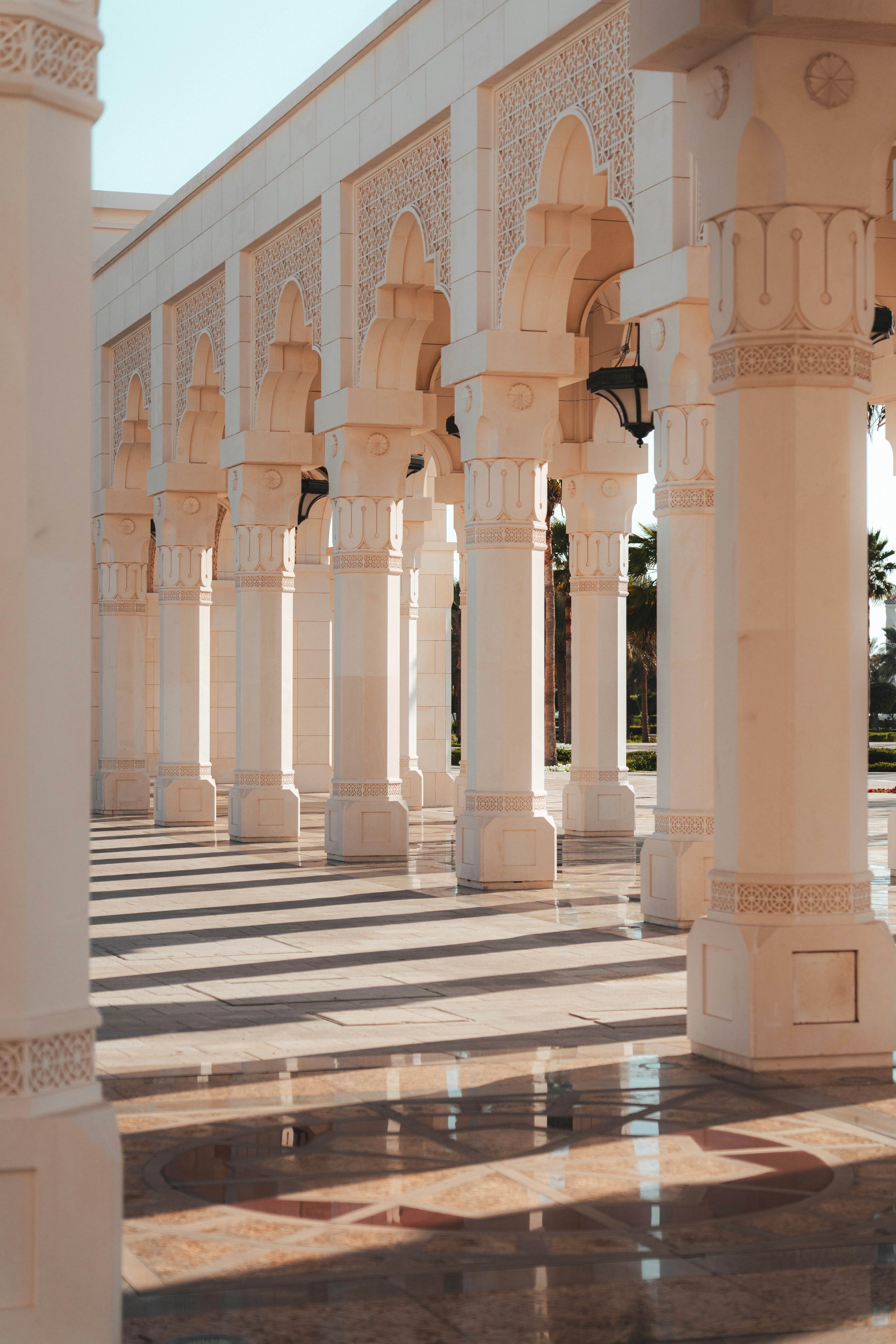 Shadowed Columns of Light: A Row of Arched Pergolas