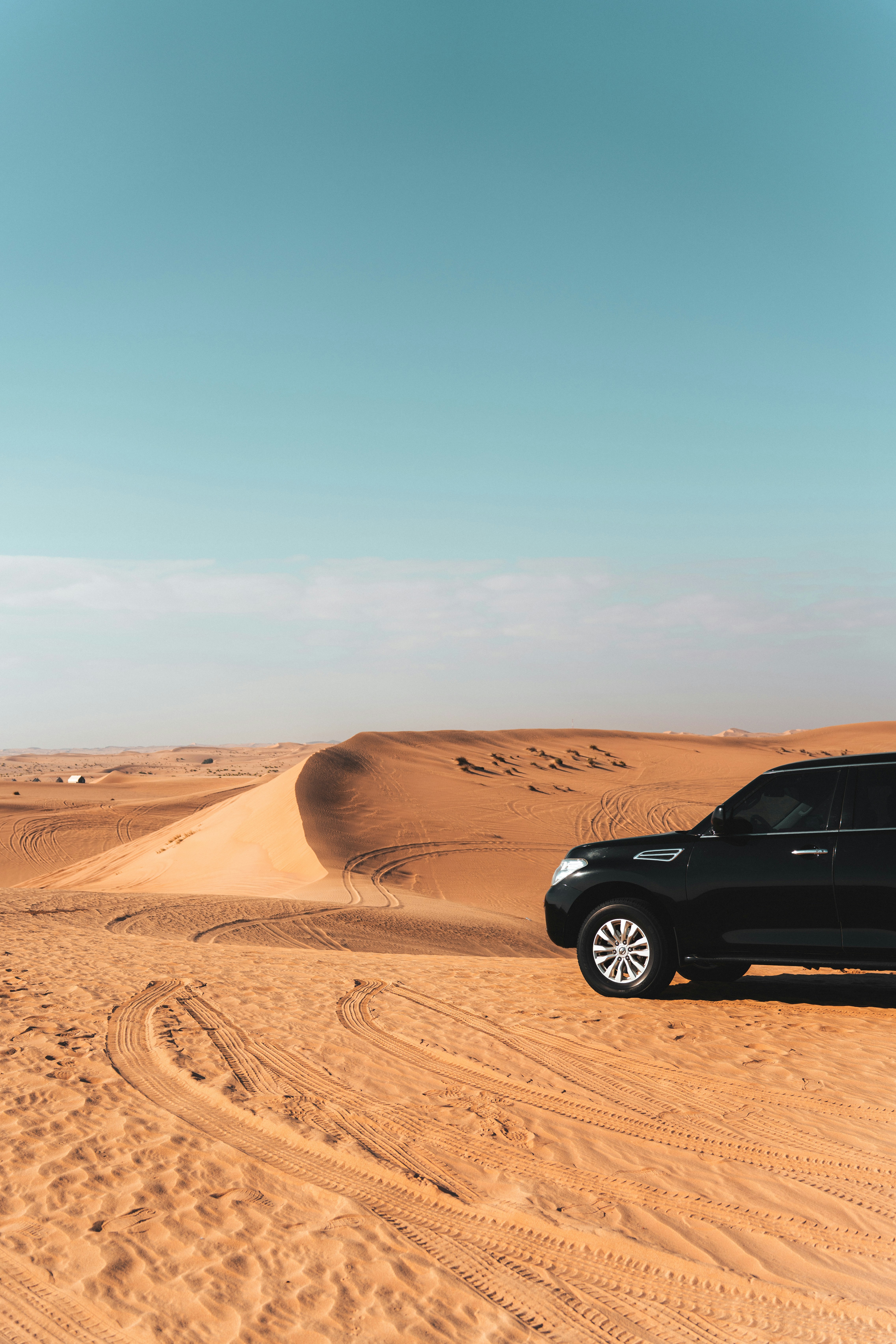 Desert Roadtrip: Black SUV Converges with Dune Horizon