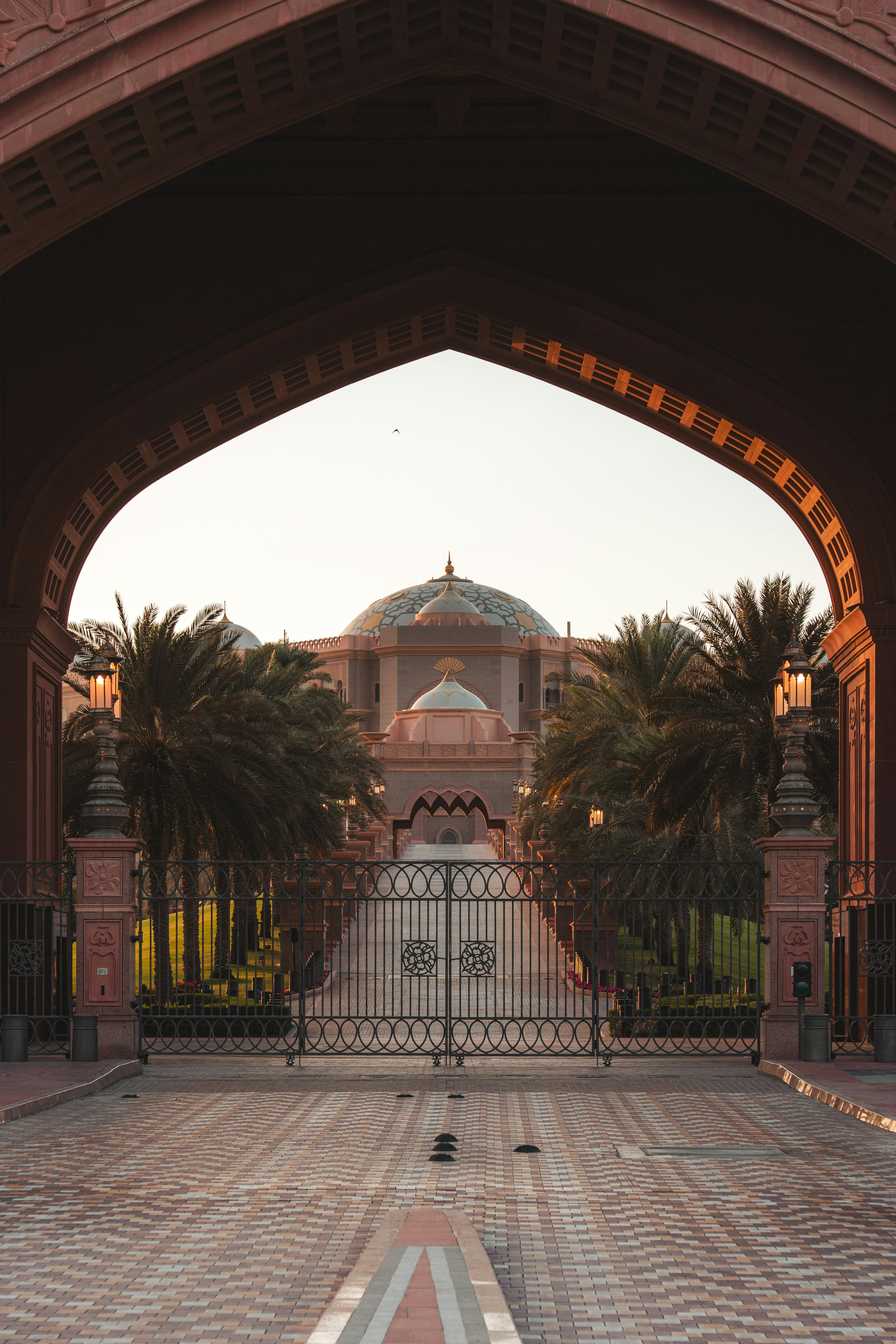 Gateway to the Palm-Arcade: Sunset Through an Ornate Arch