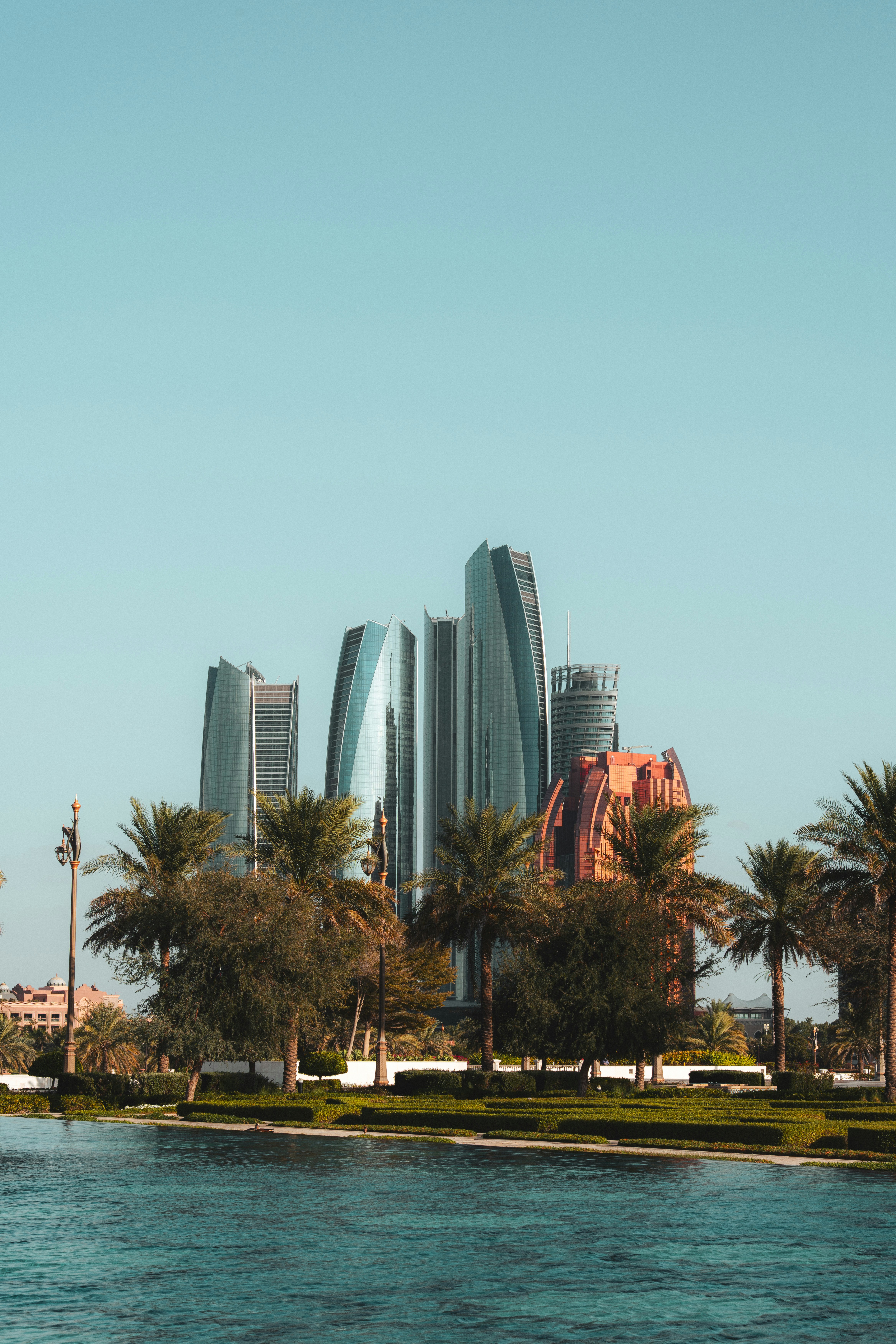 Azure Towers Rising Over Palm-Filled Waterfront