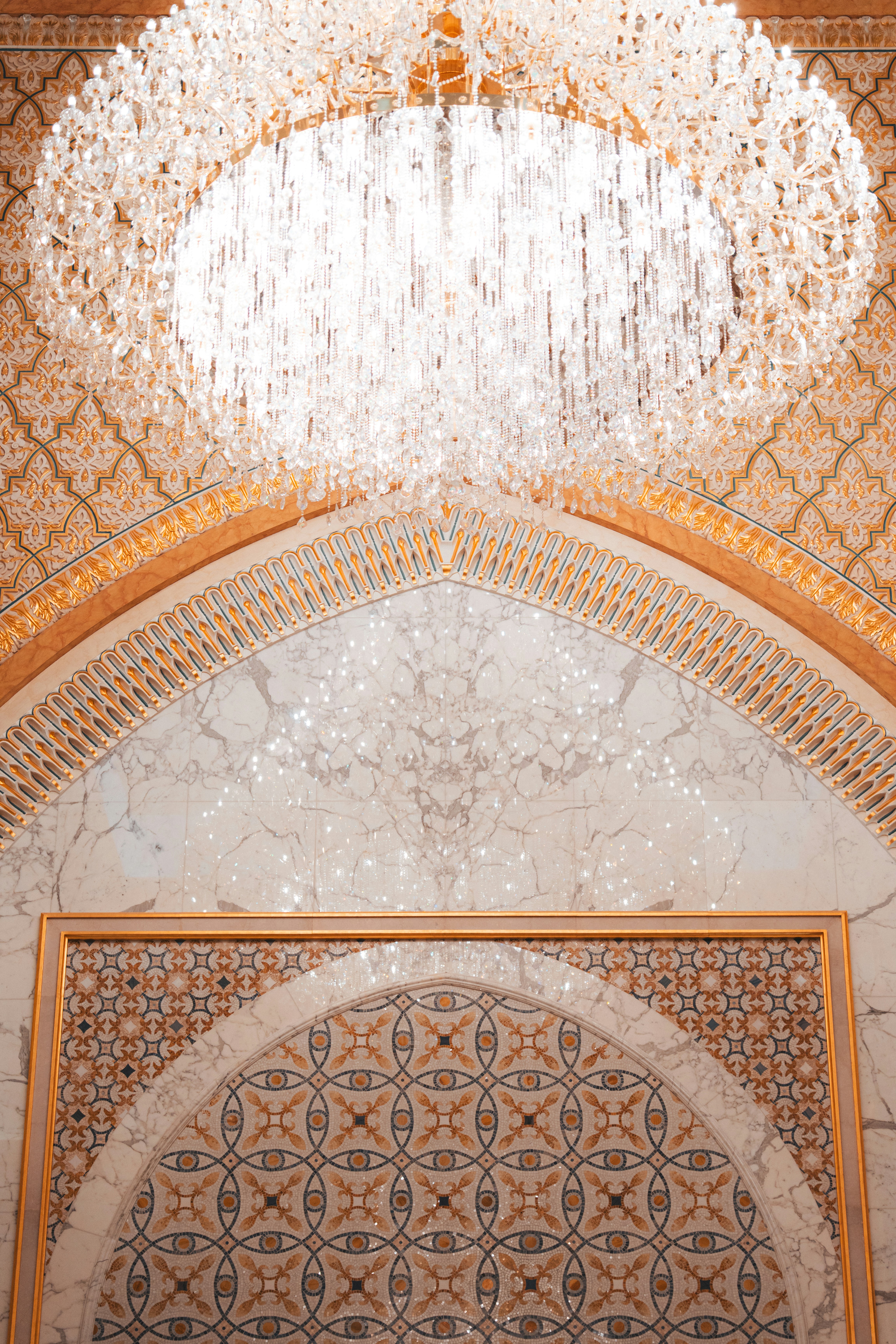 Grand Interior: Crystal chandelier over marble archway