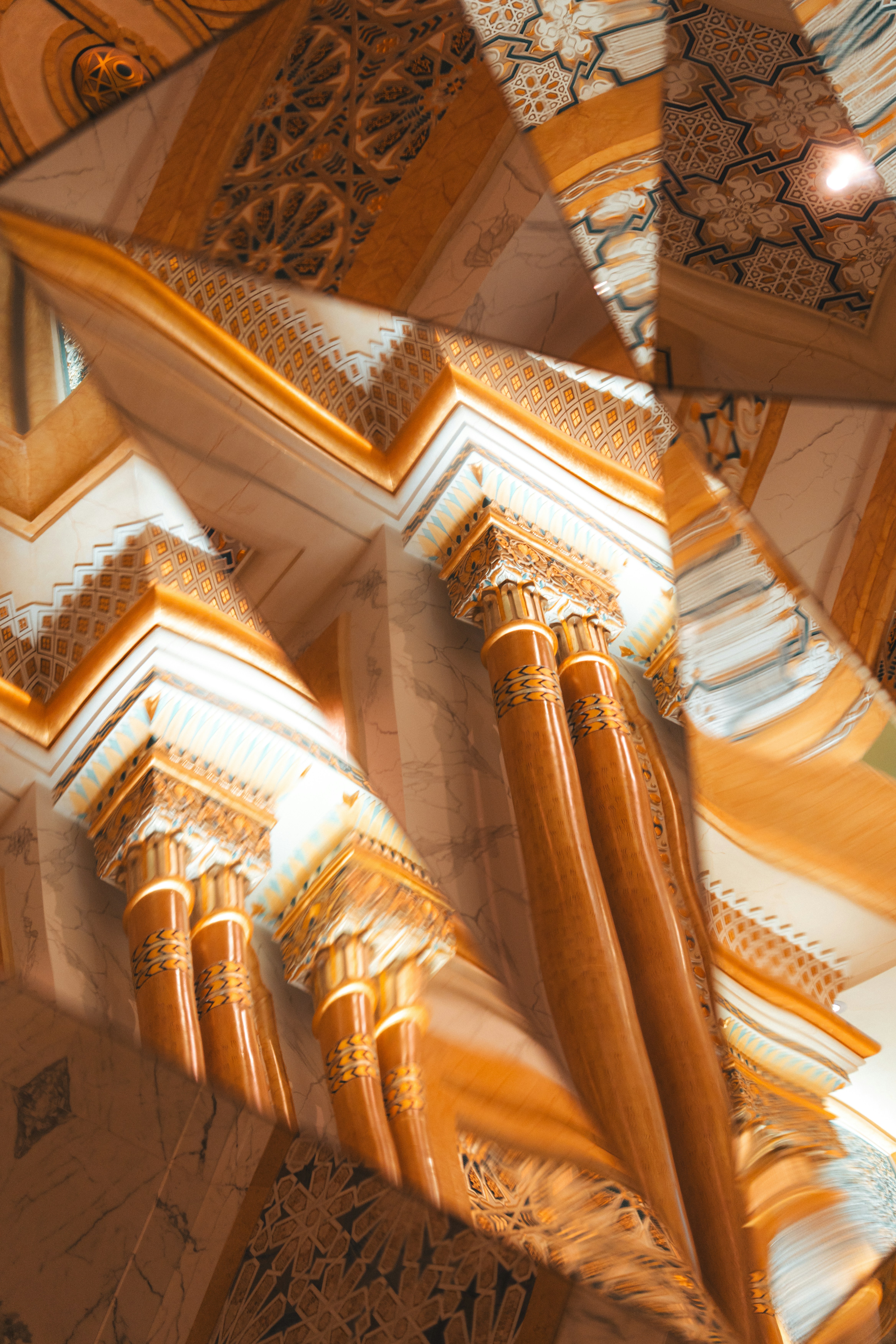 Golden Carved Columns In a Kaleidoscopic Interior