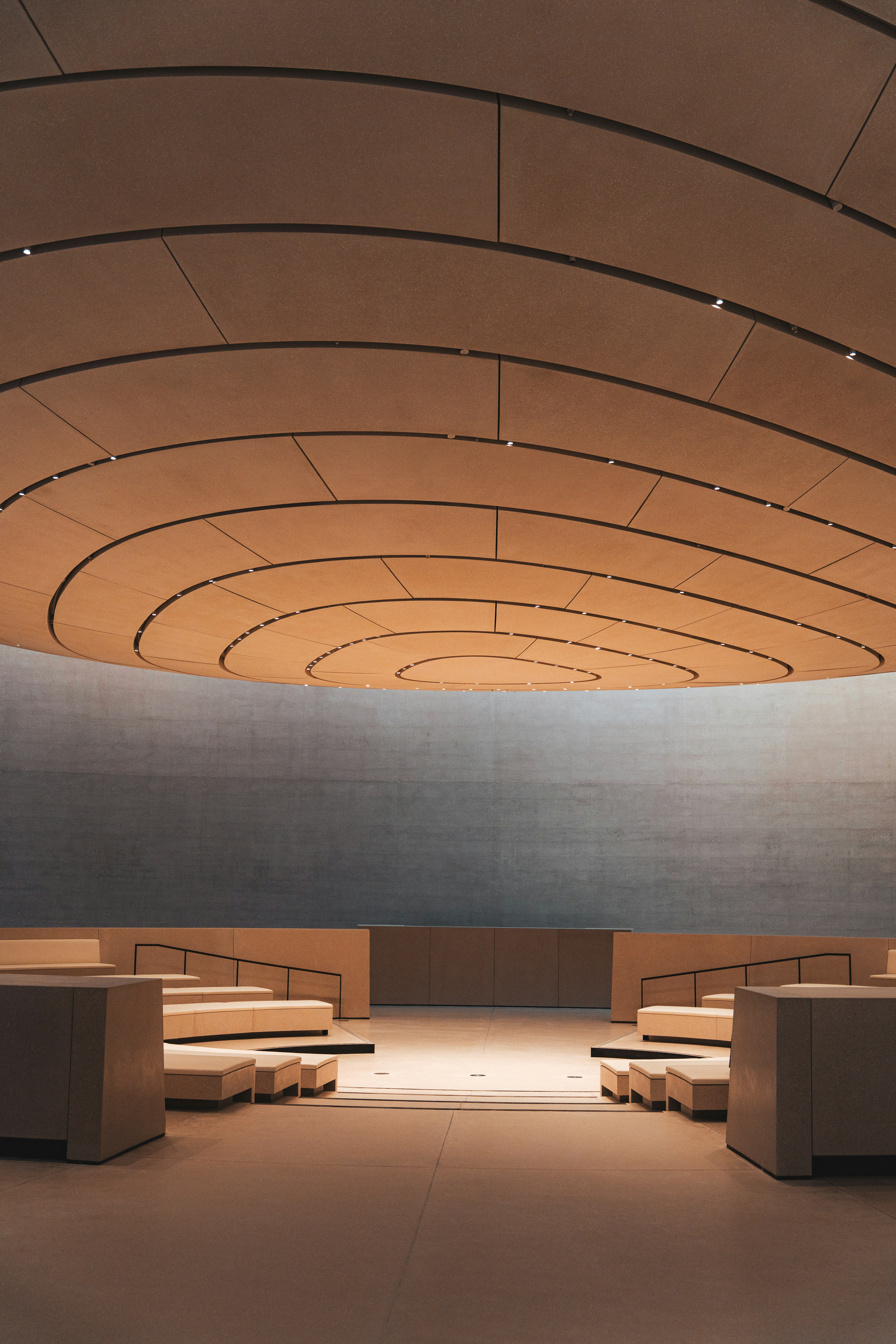 Circular Ceiling Convergence over Minimalist Lounge