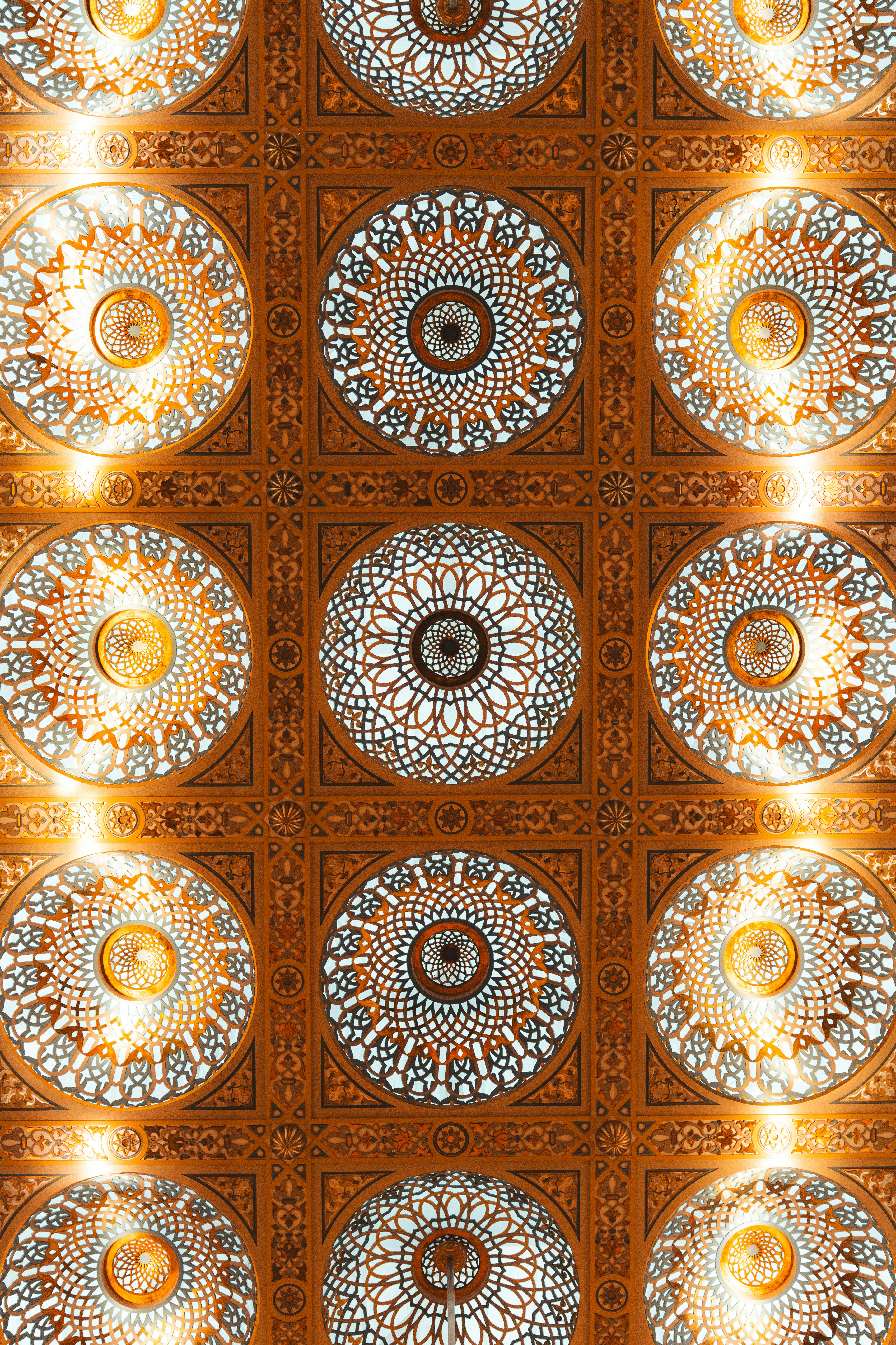 Ornamental Sunbursts: Repeating Mosaic Ceilings in Burnished Light