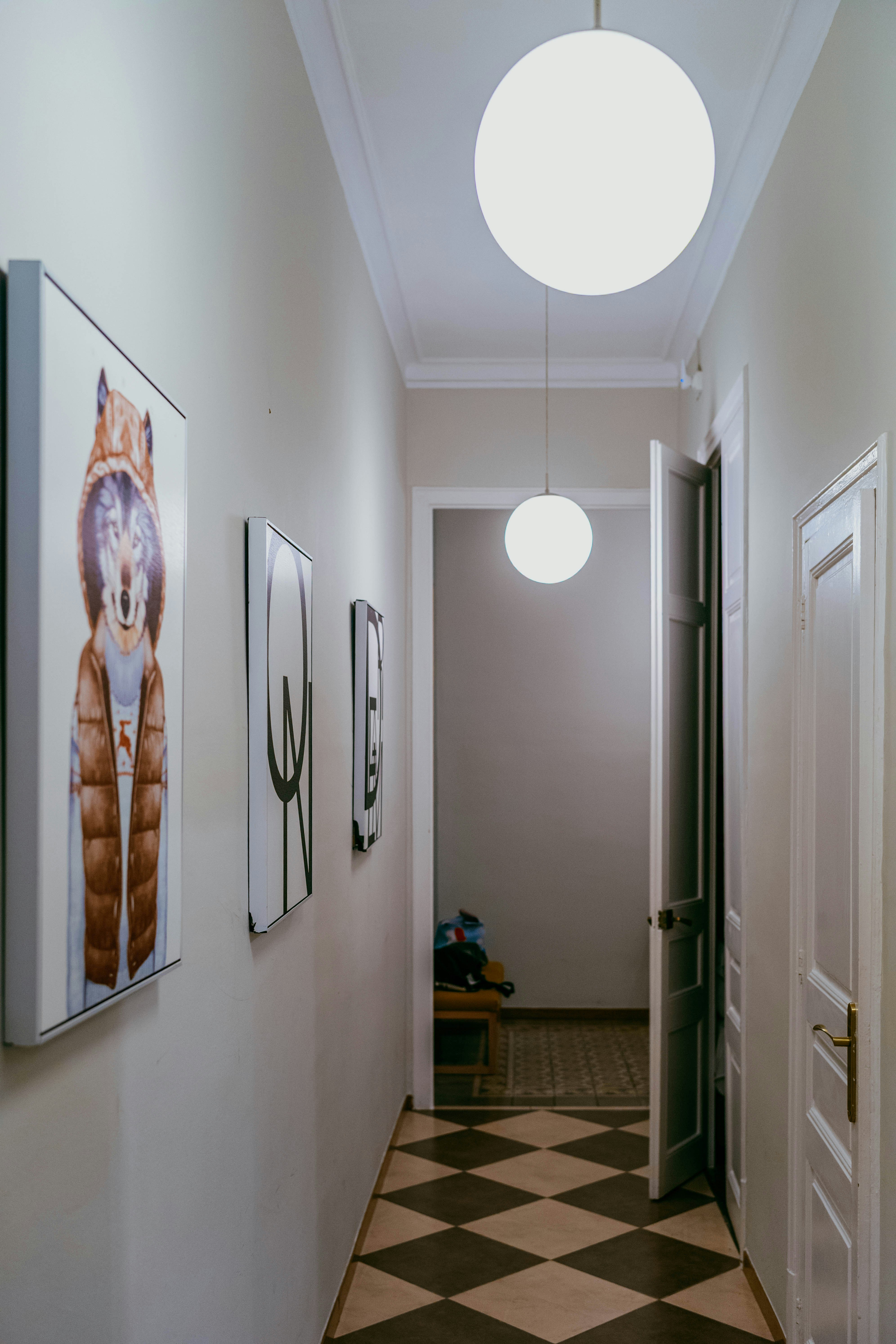 Long Corridor Gallery with Oversized Globe Lights