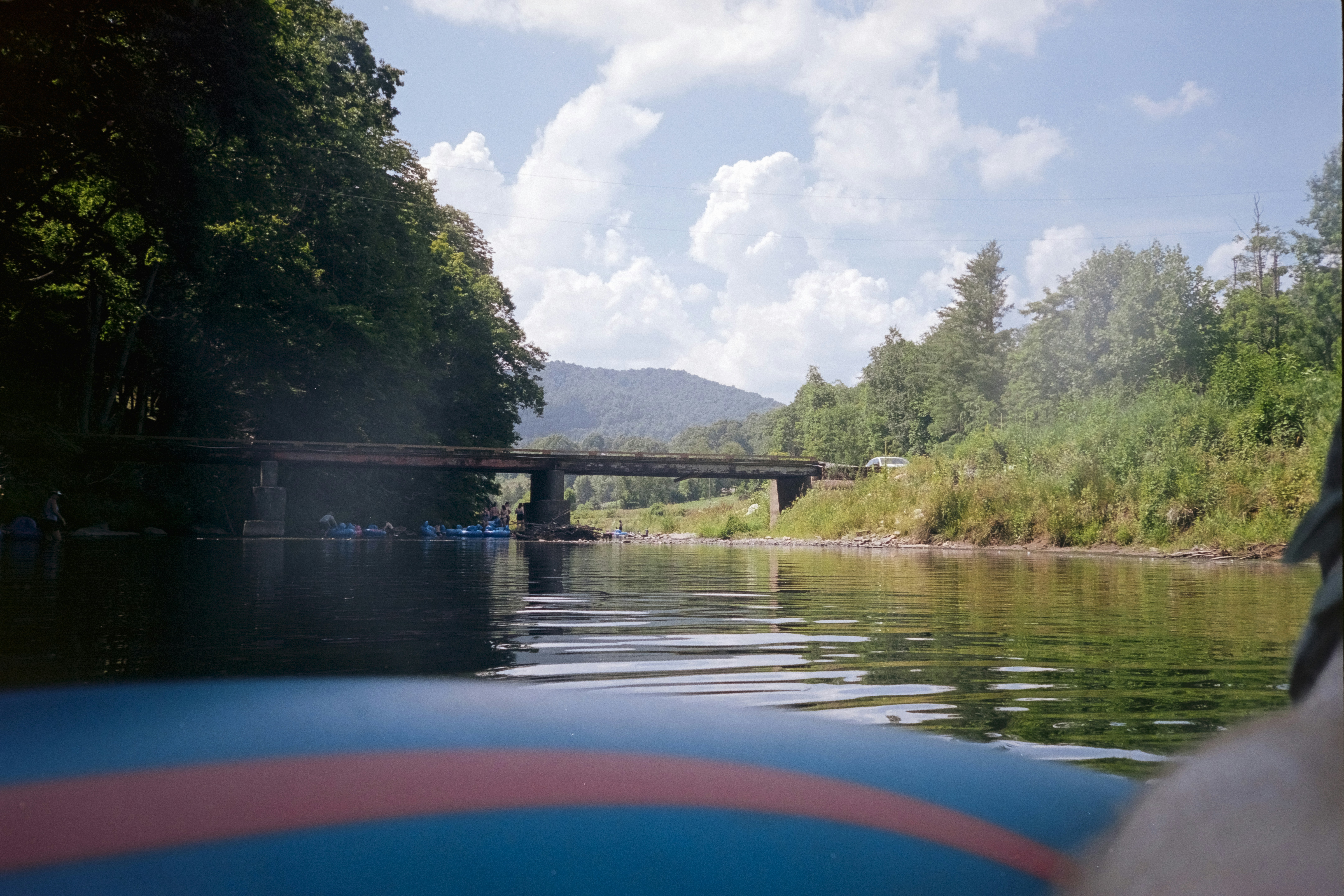 Front-of-Boat View: River, Bridge, and Texture of Water