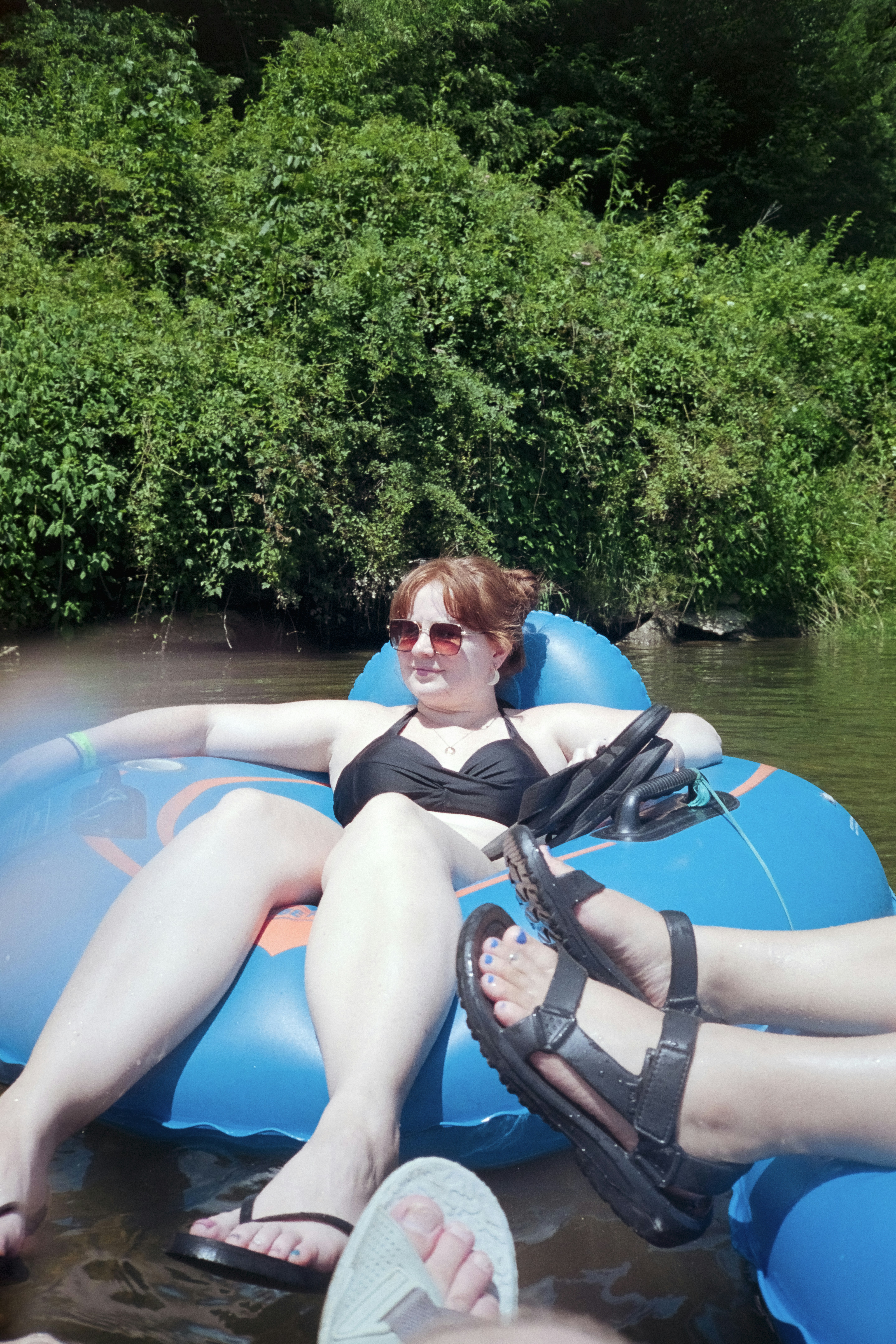 Relaxed Floating Escape: Sunlit Leisure on a Bluesky Tube