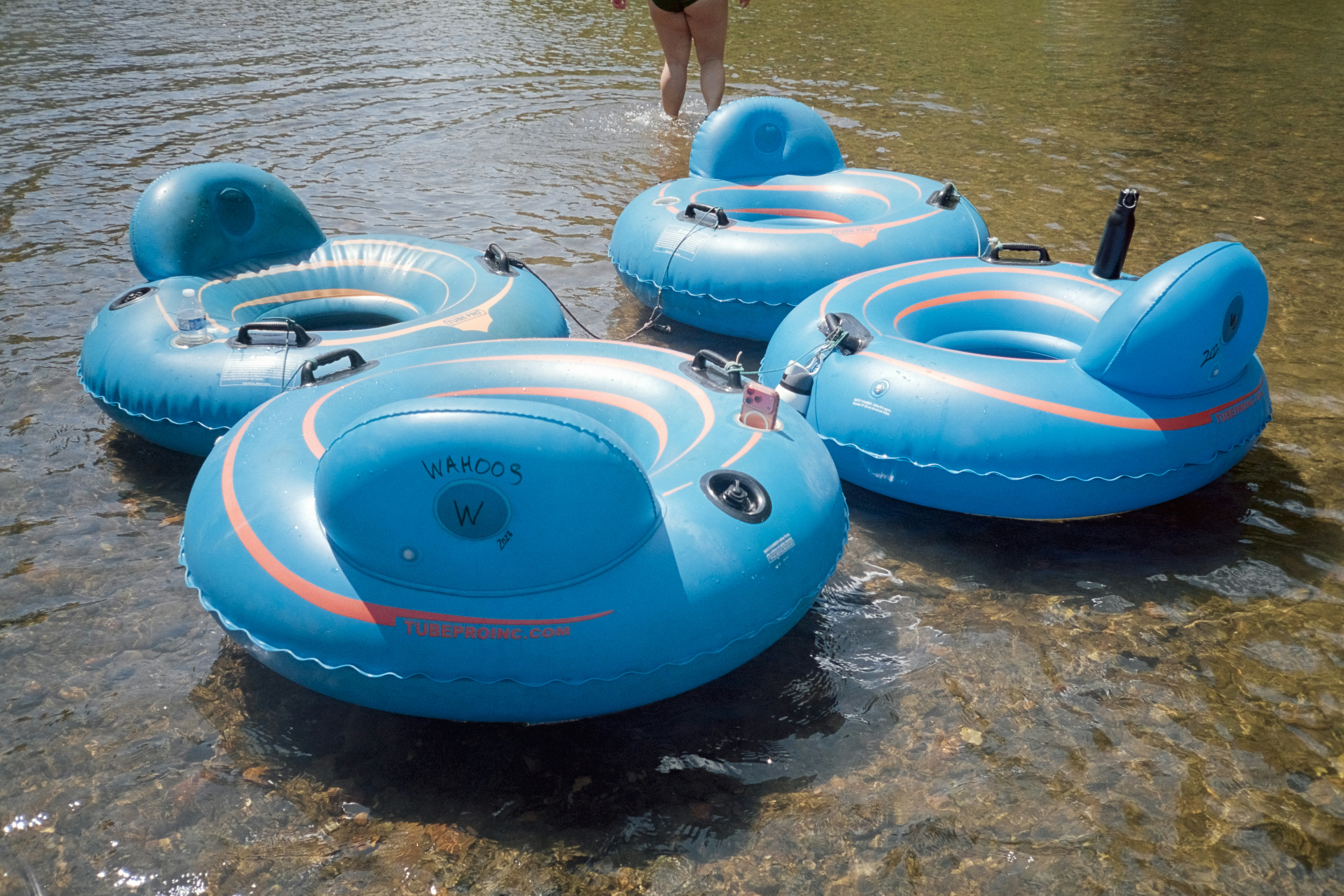Blue Tubes on Calm River: A Trio of Floating Rings