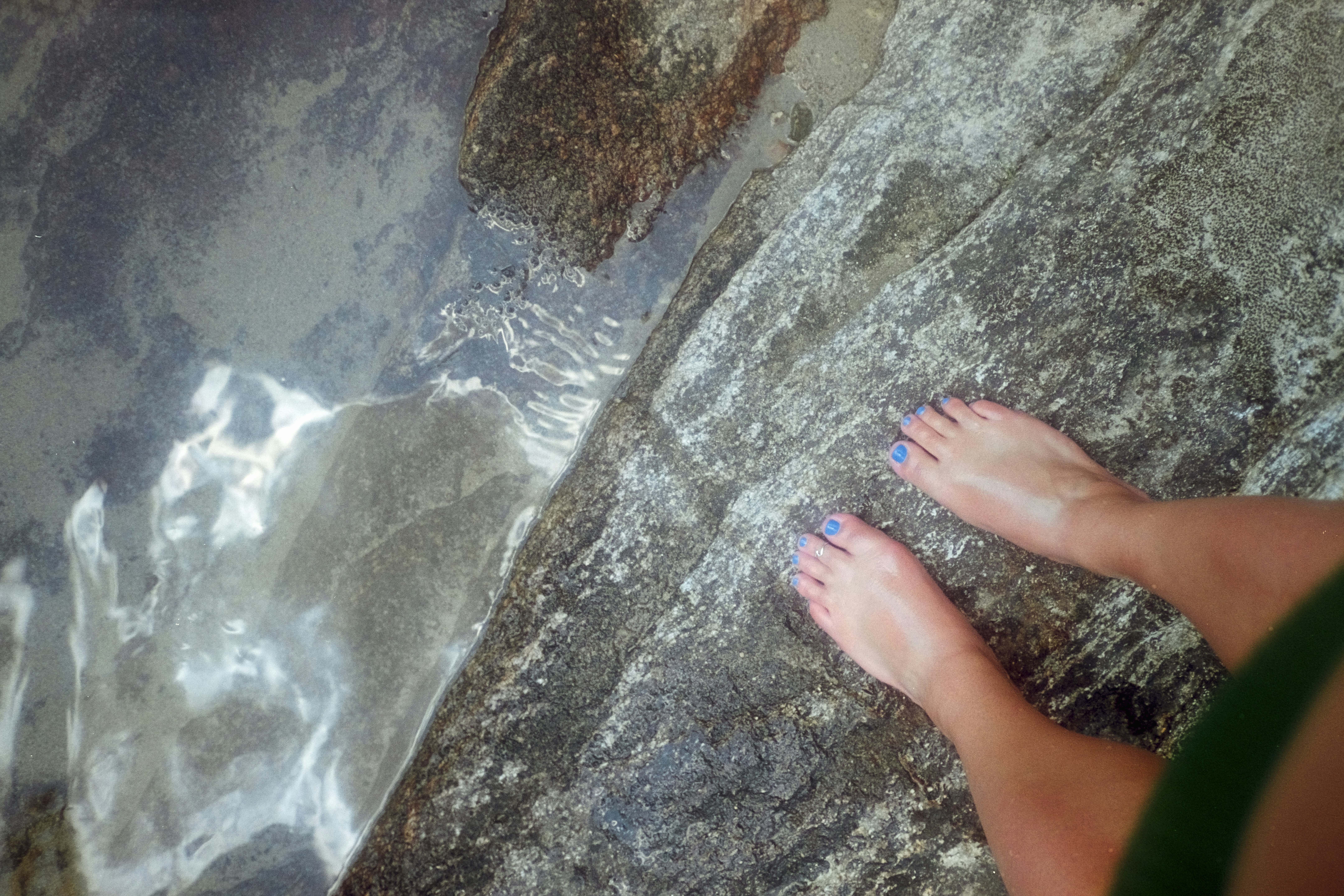 Bare Feet at the Edge: A Seaside Footpath Between Rock and Tide