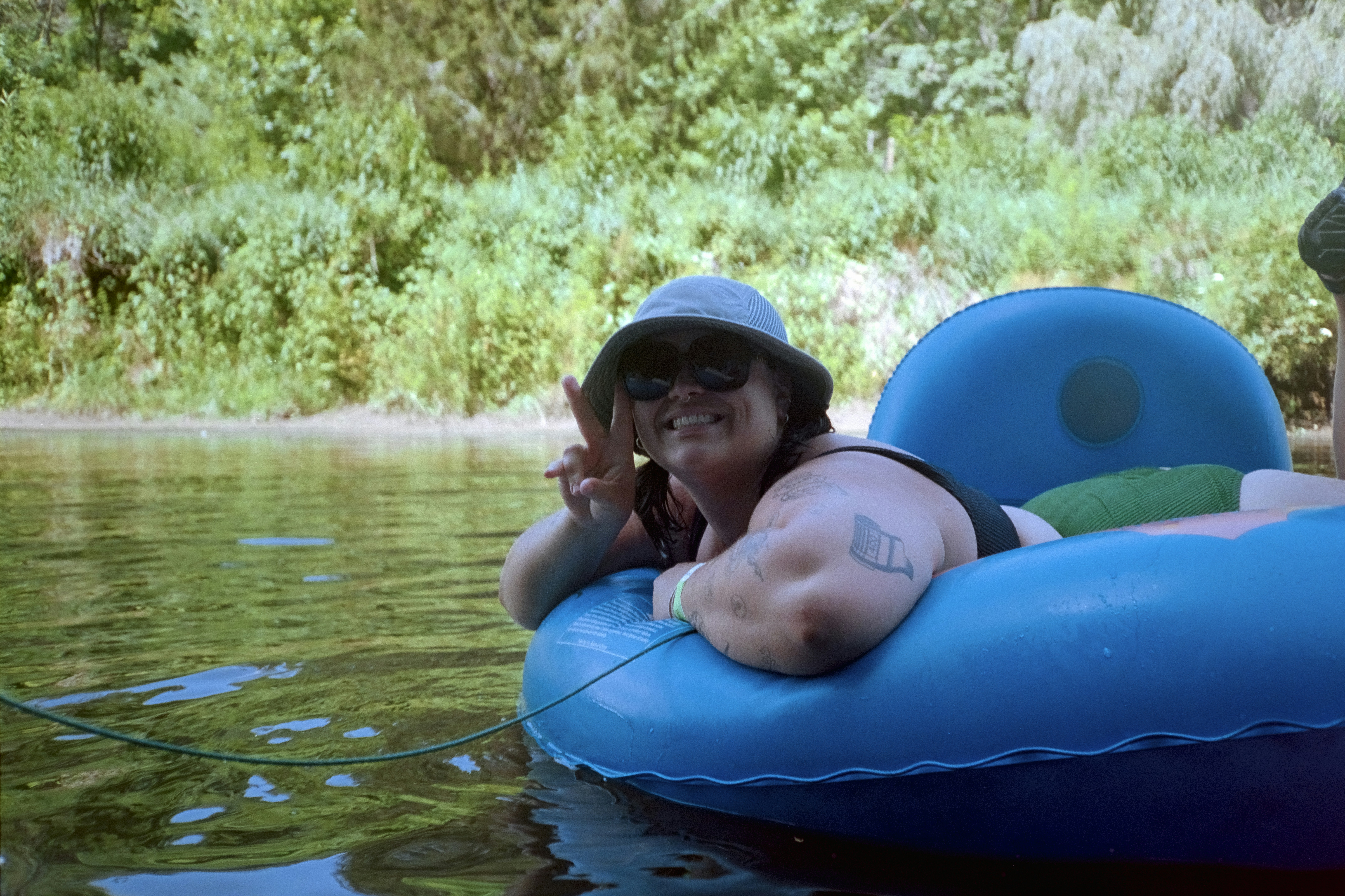 Floating Smile: Relaxed Portrait on a River Tub