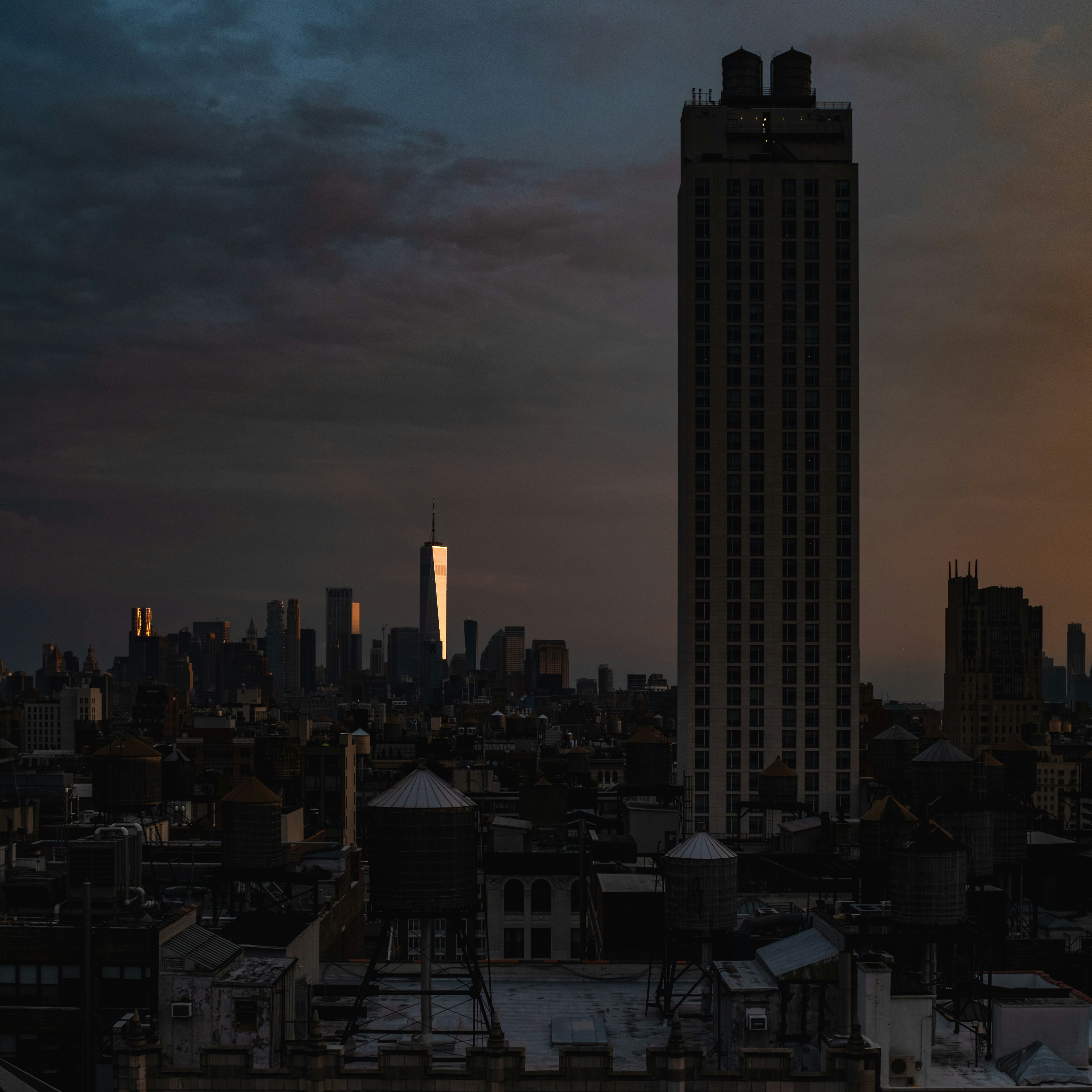 Dusk Over Manhattan: A Silhouette of Towers Against a Dim Sky