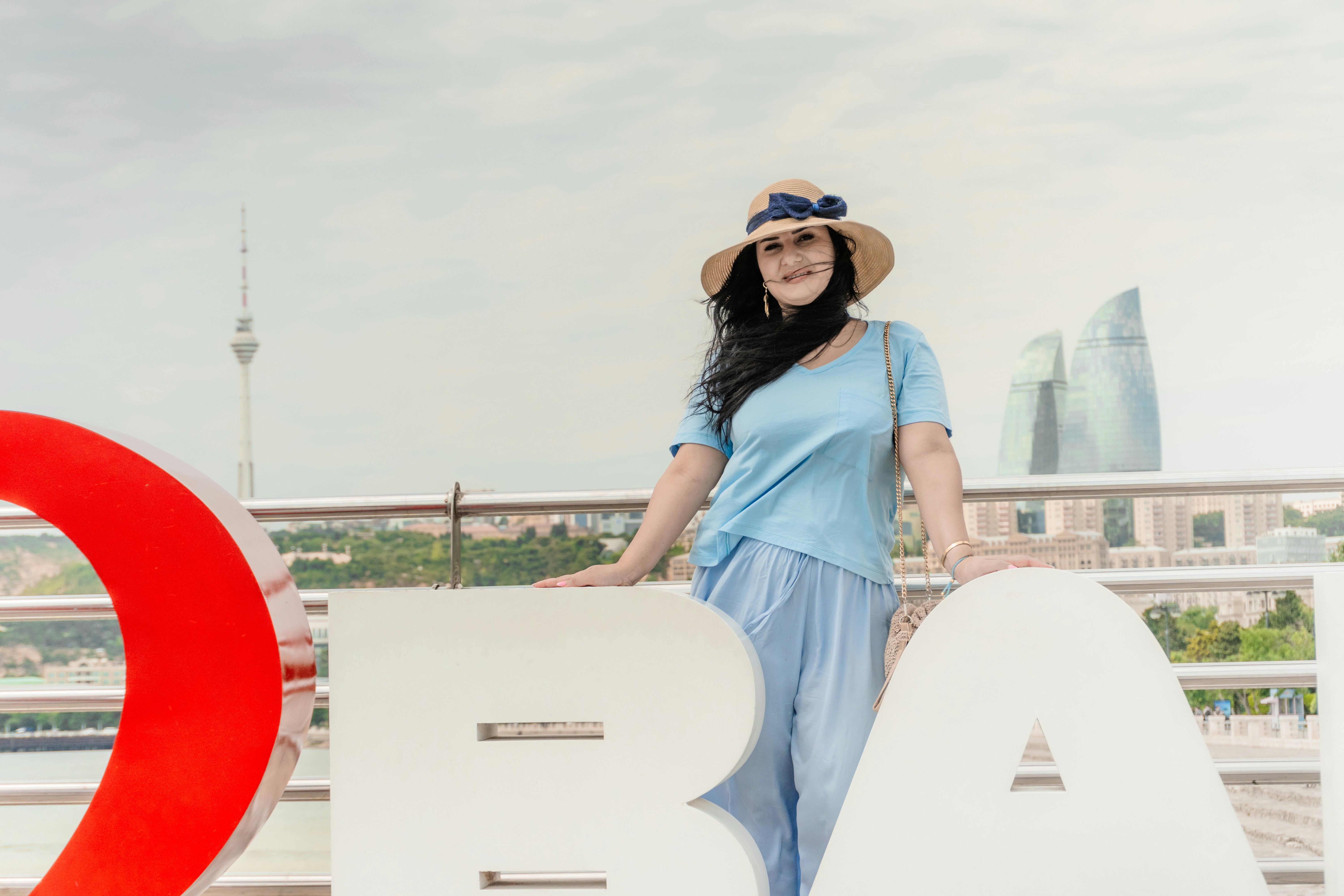 Sunlit Breeze: A Stylish Stroll by the Waterfront Letters
