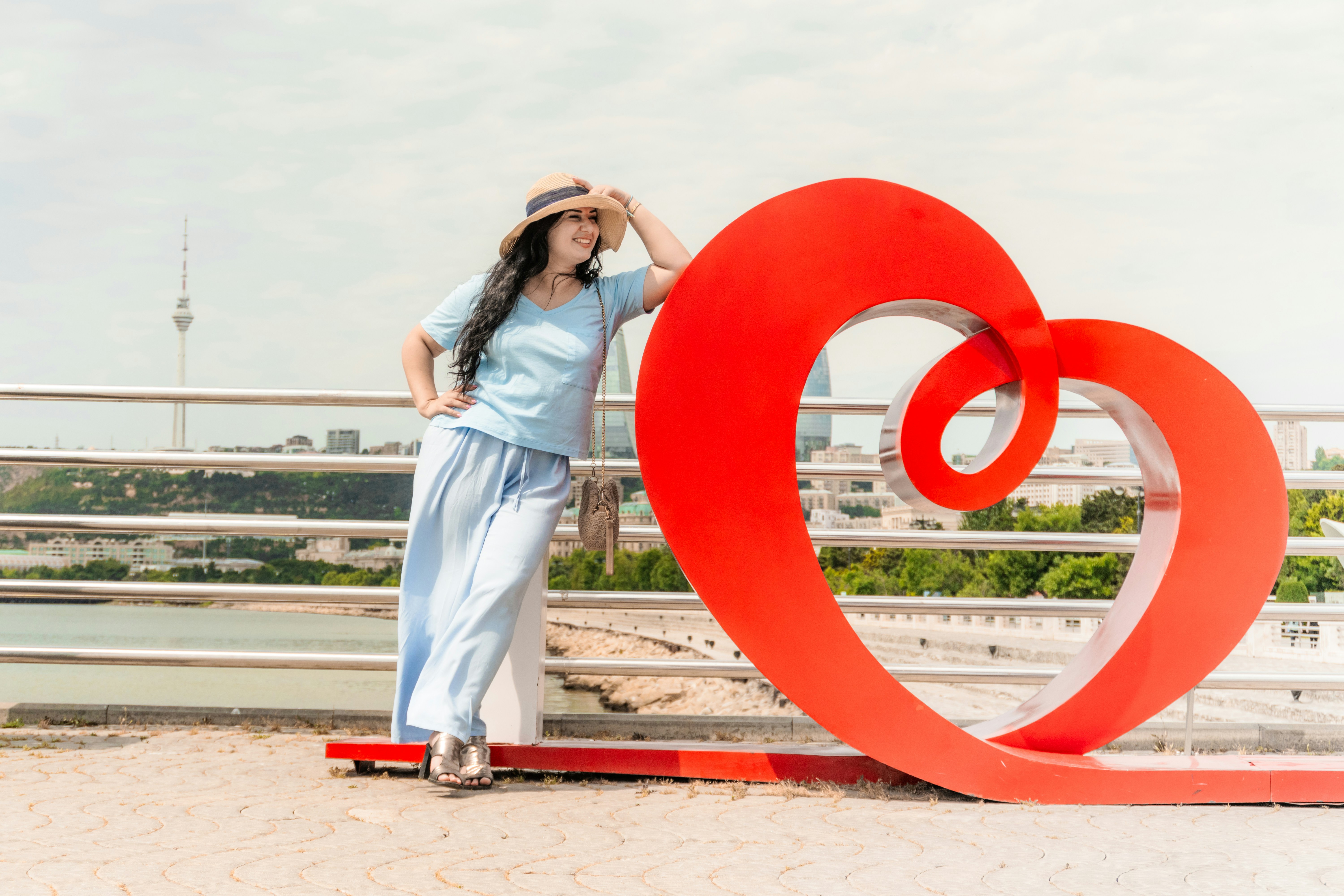 Portrait by the Red Heart: Cheerful Pose with a Sculptural Pop