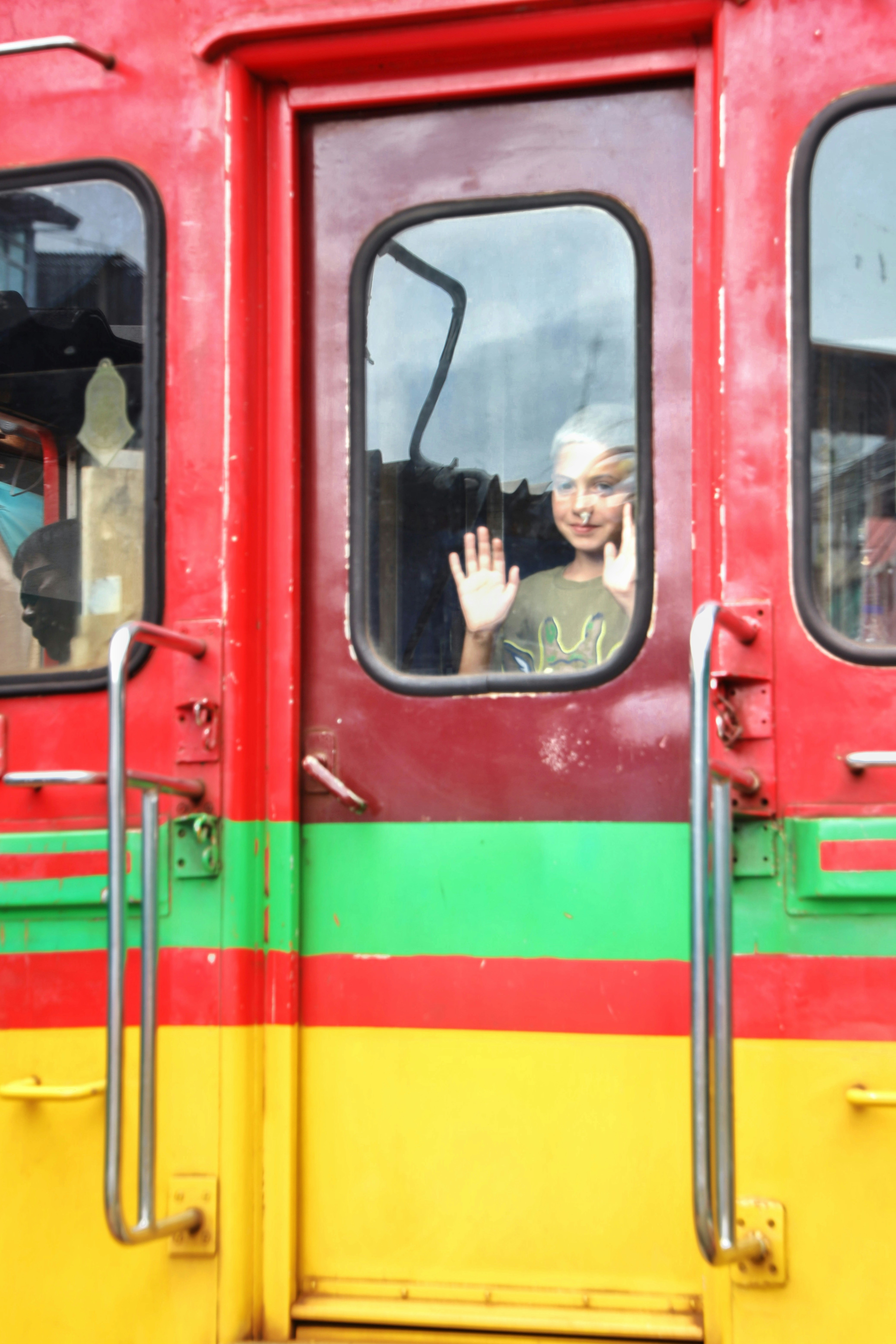 Red Window, Quiet Wave: A Passenger’s Gaze