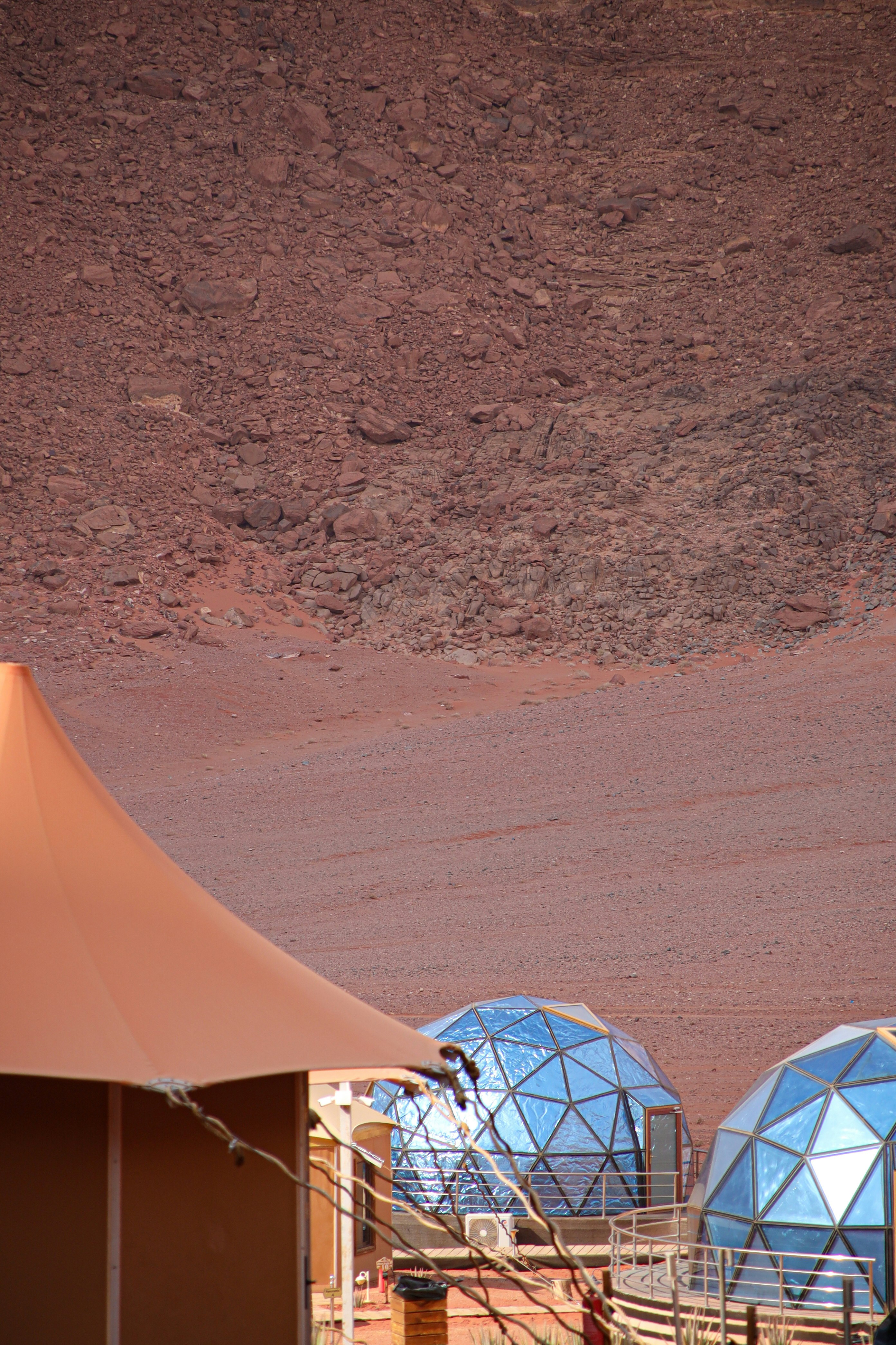 Desert Camp at Dusk: Geodesic Domes and a Tented Outpost