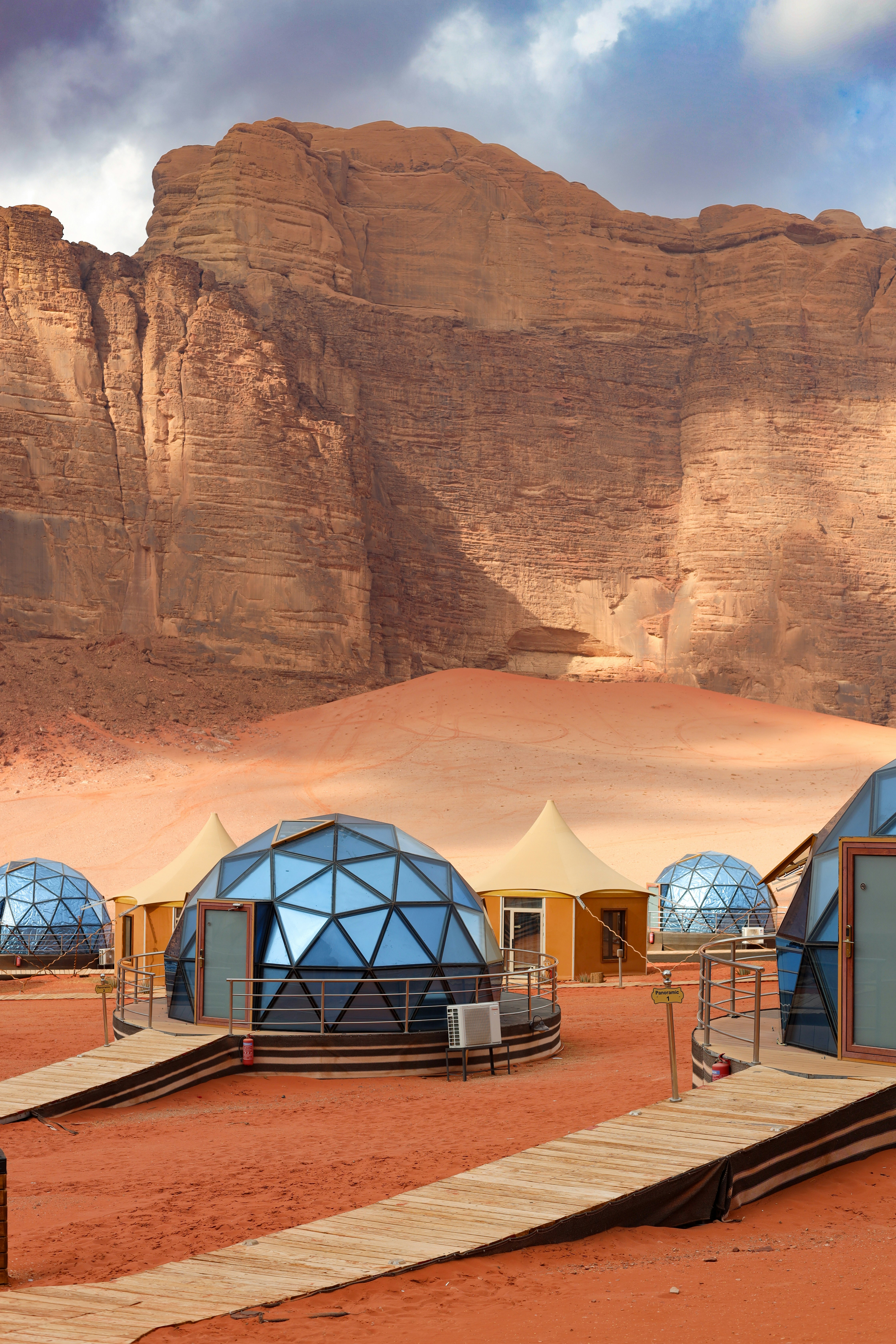 Geodesic Domes Meet Desert Cliffs: Calm Campgrounds Amid Red Rock