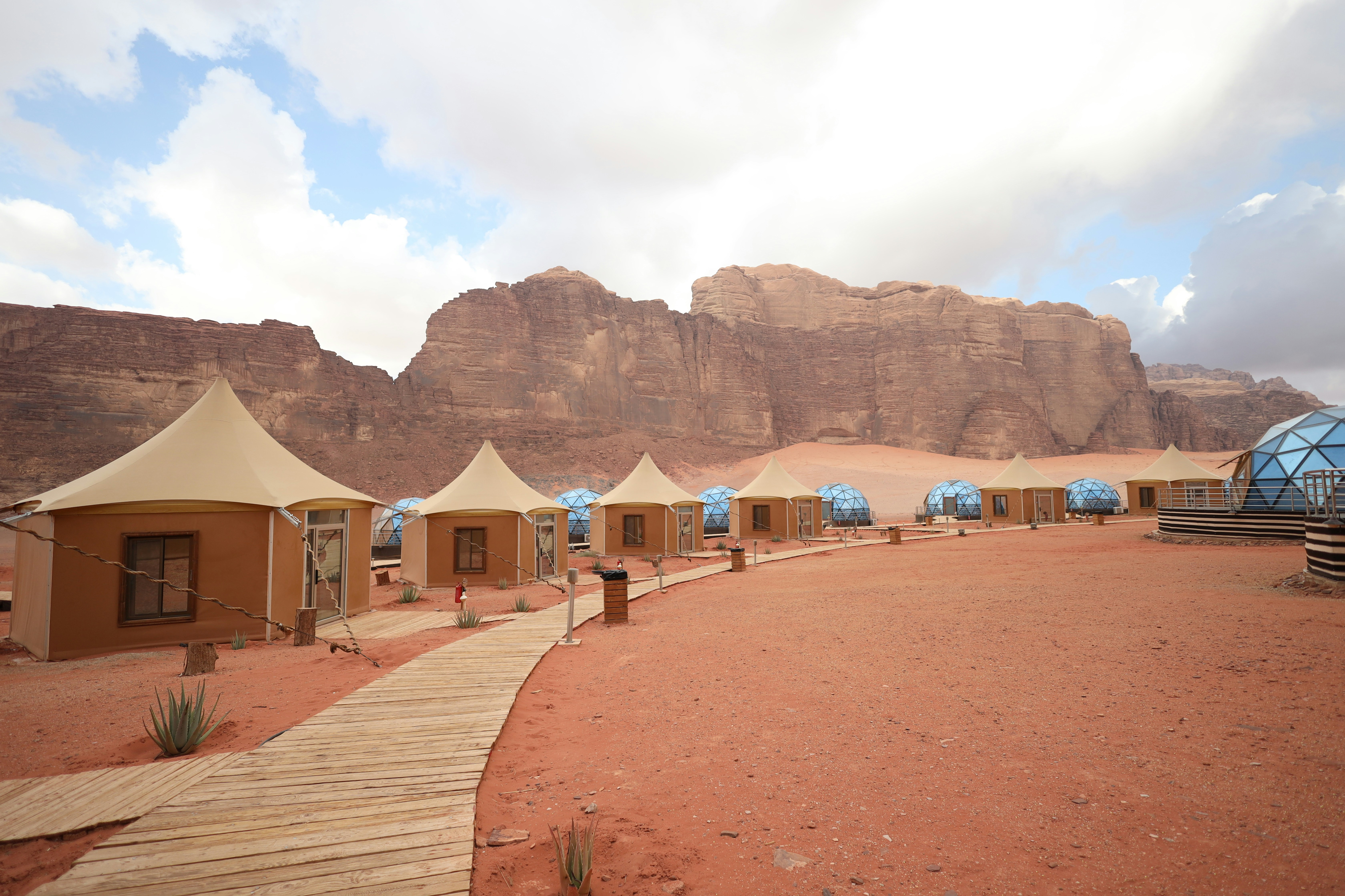 Desert Camp Horizon: Tents Along the Red Rock Ridge