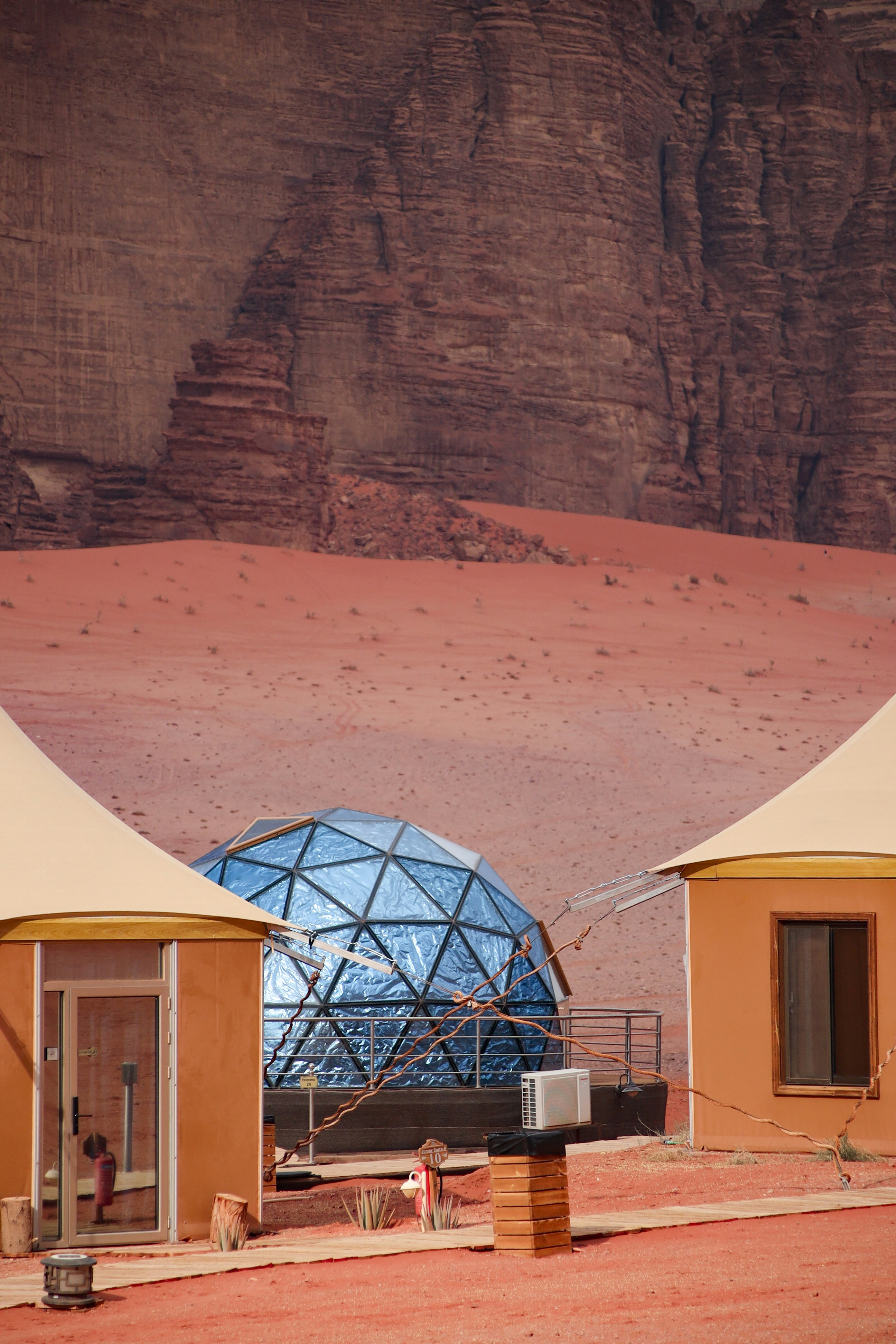 Geodesic Dome among Desert Tents at Dusk