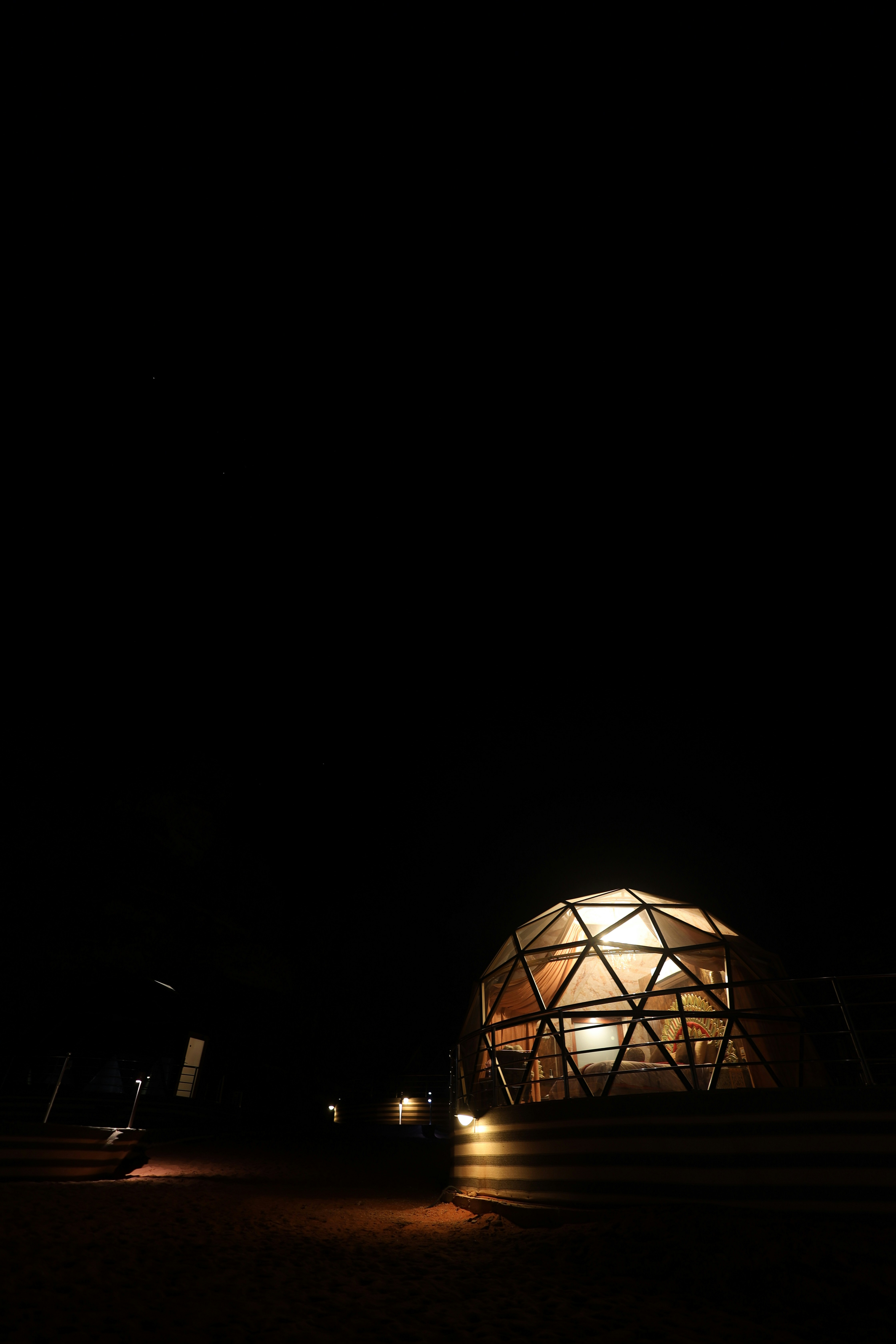 Glowing Geodesic Dome Against a Velvet Night