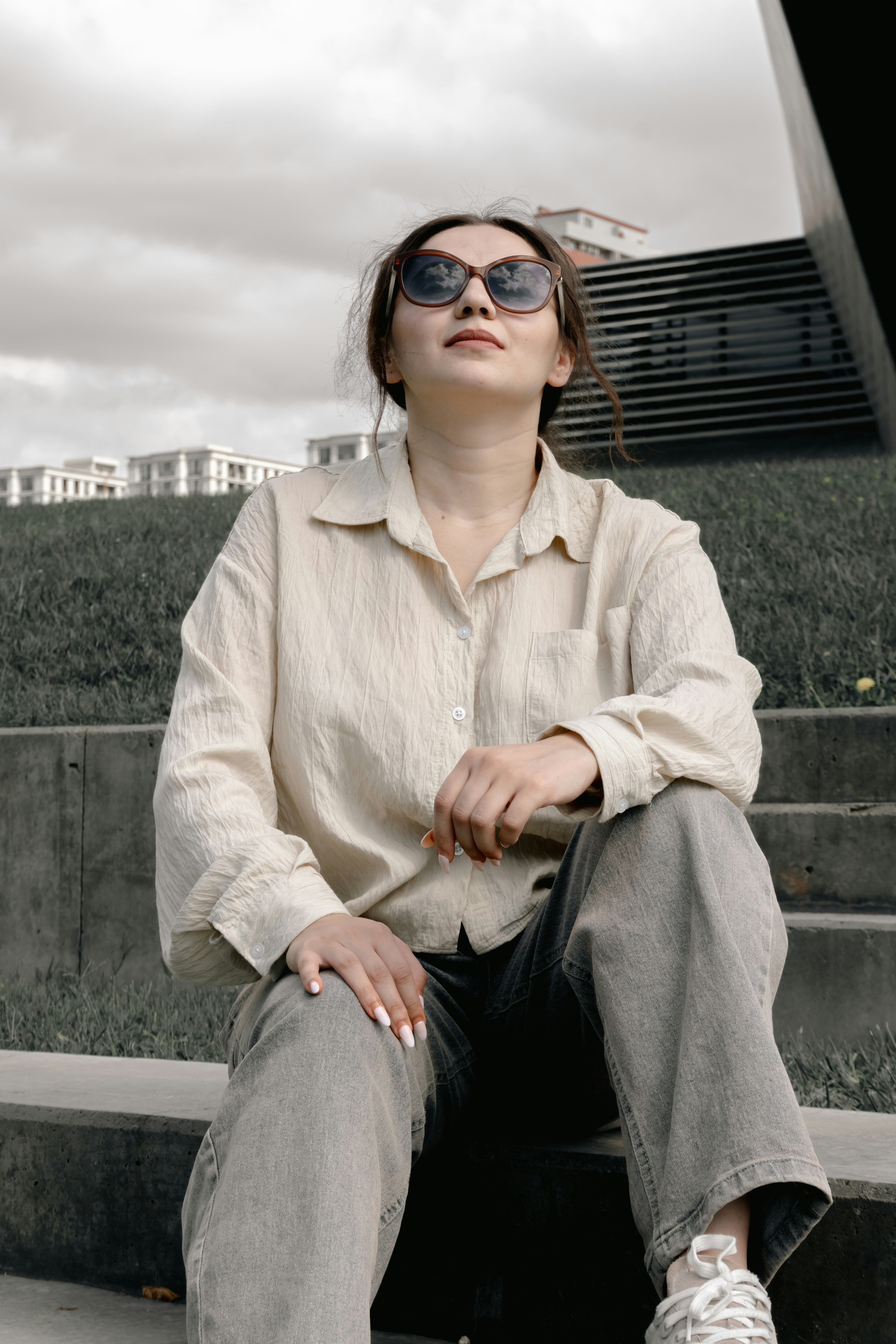 Sunglasses and Serenity: A Quiet Moment on City Steps