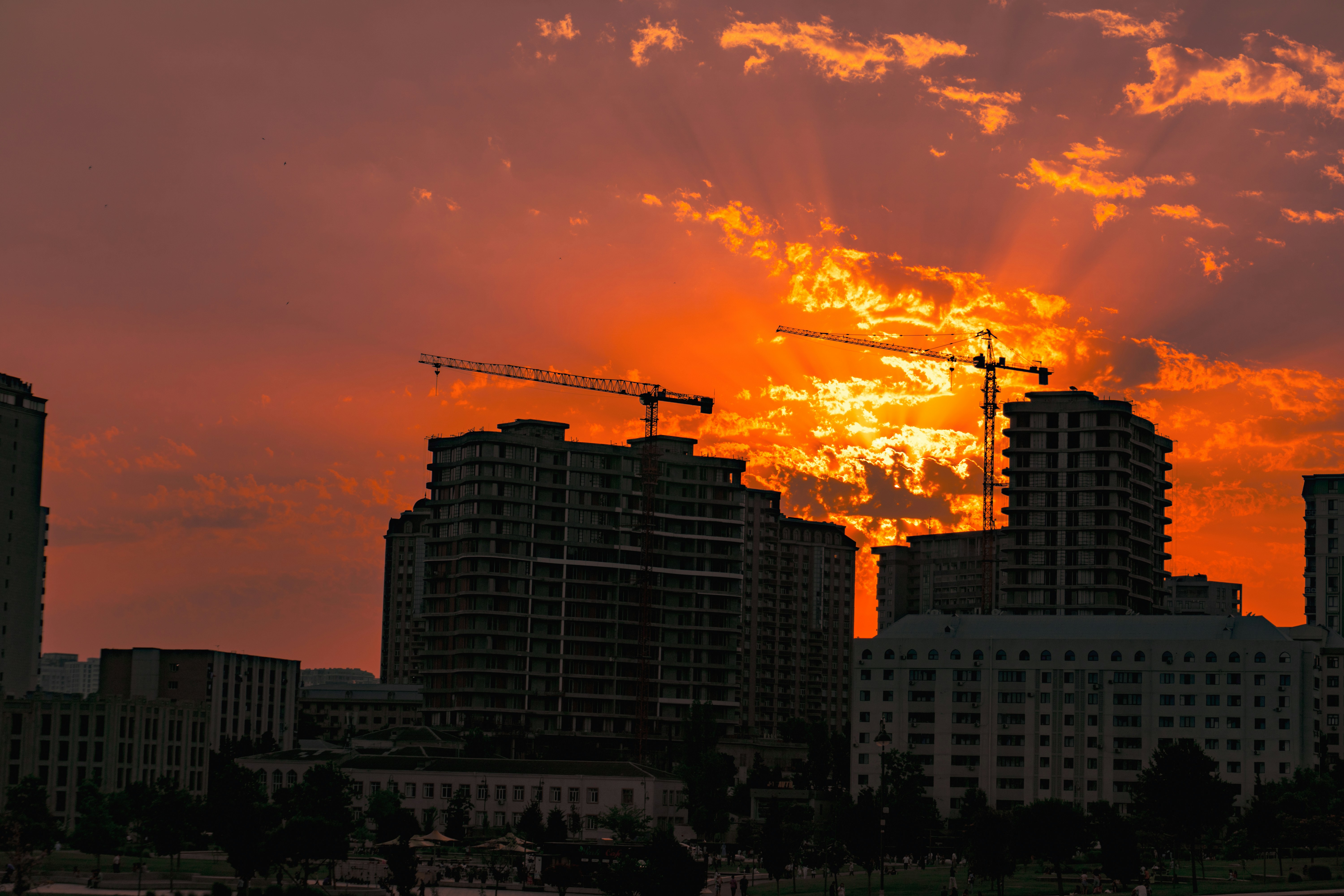 Crimson Skyline: Construction Cradled by a Fiery Sunset