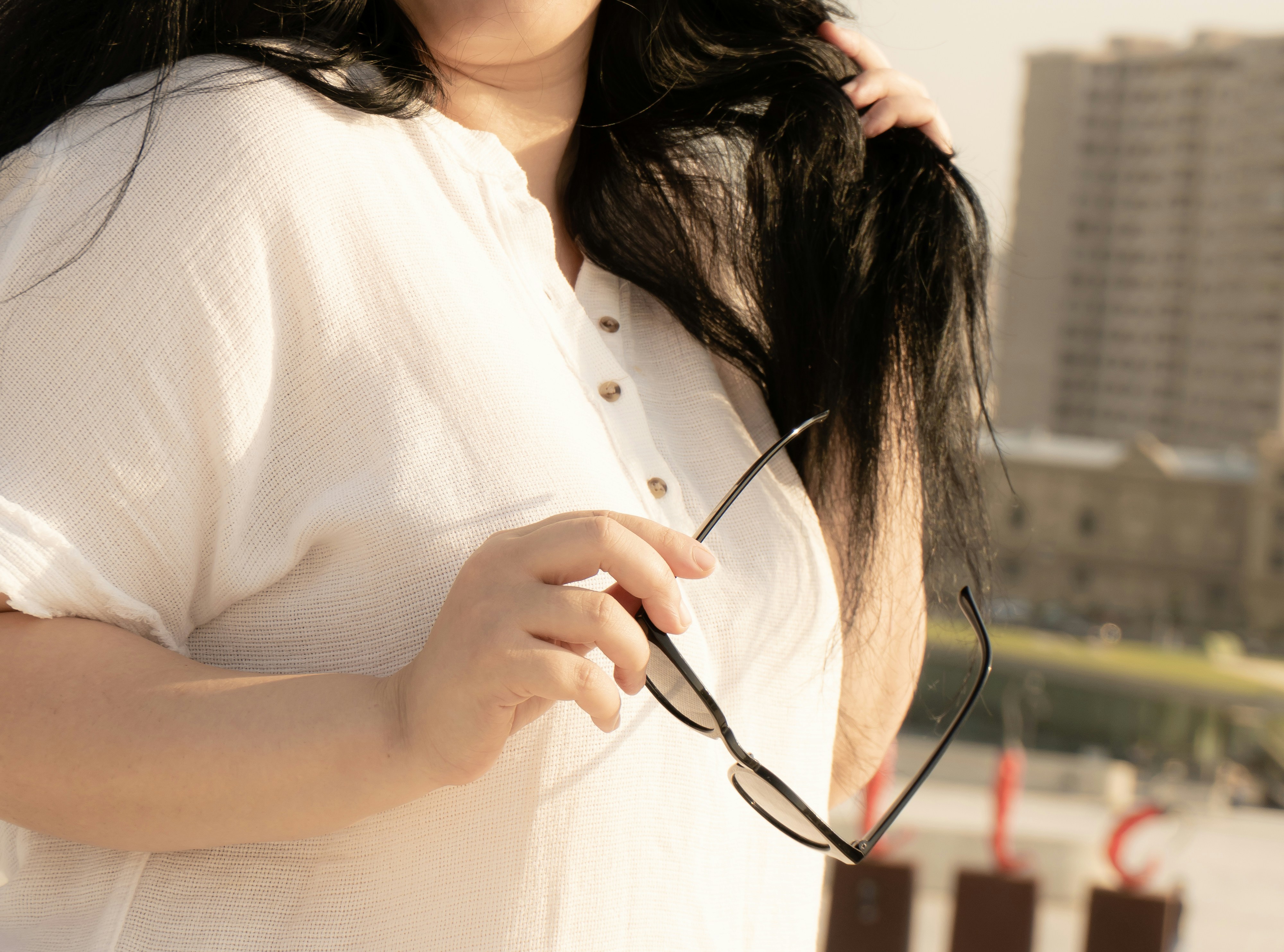 Sunlit Confidences: A Closer Look at the Glasses Pendant