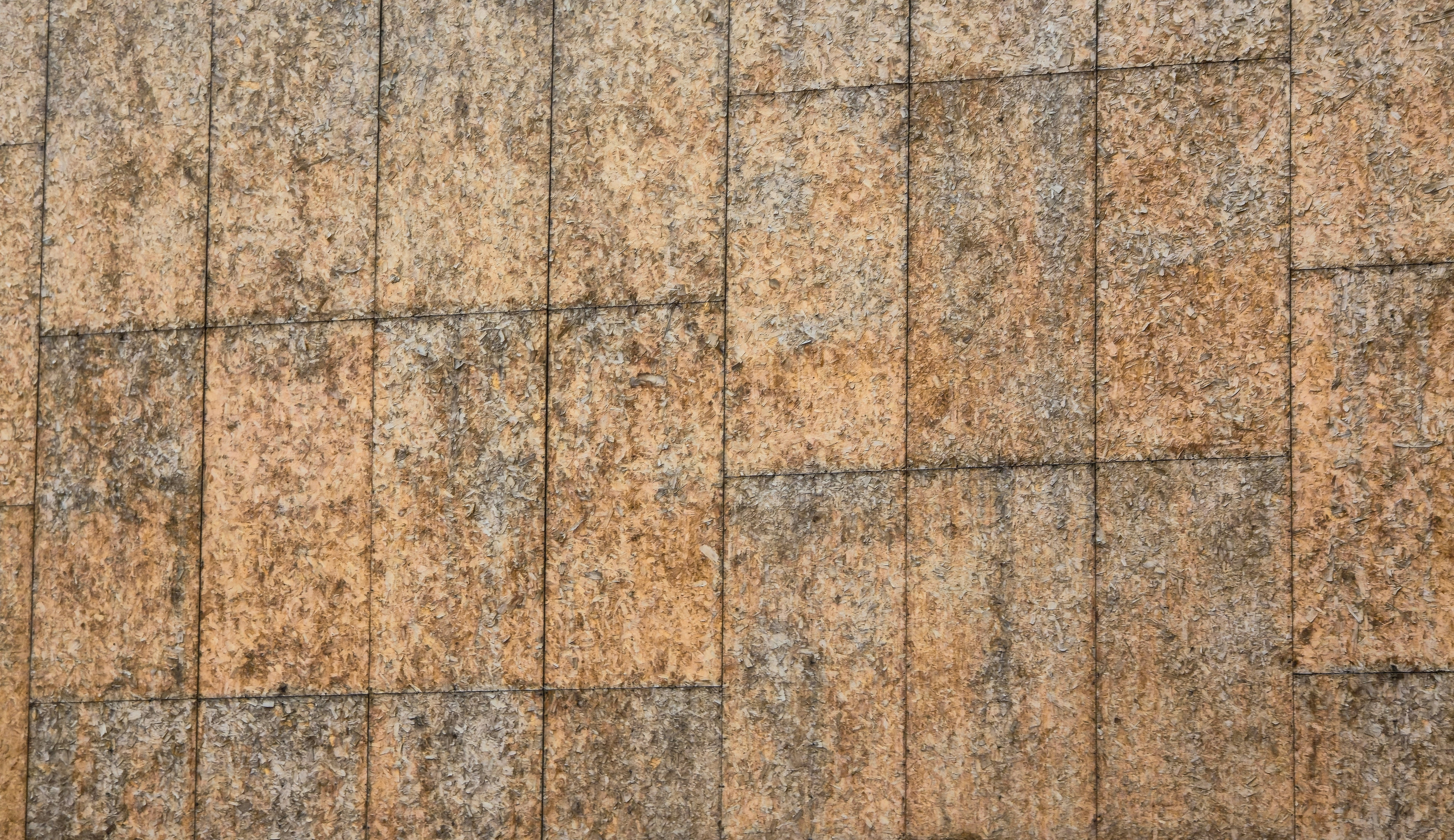 Aligned Stones: A Tesselated Wall of Weathered Brick