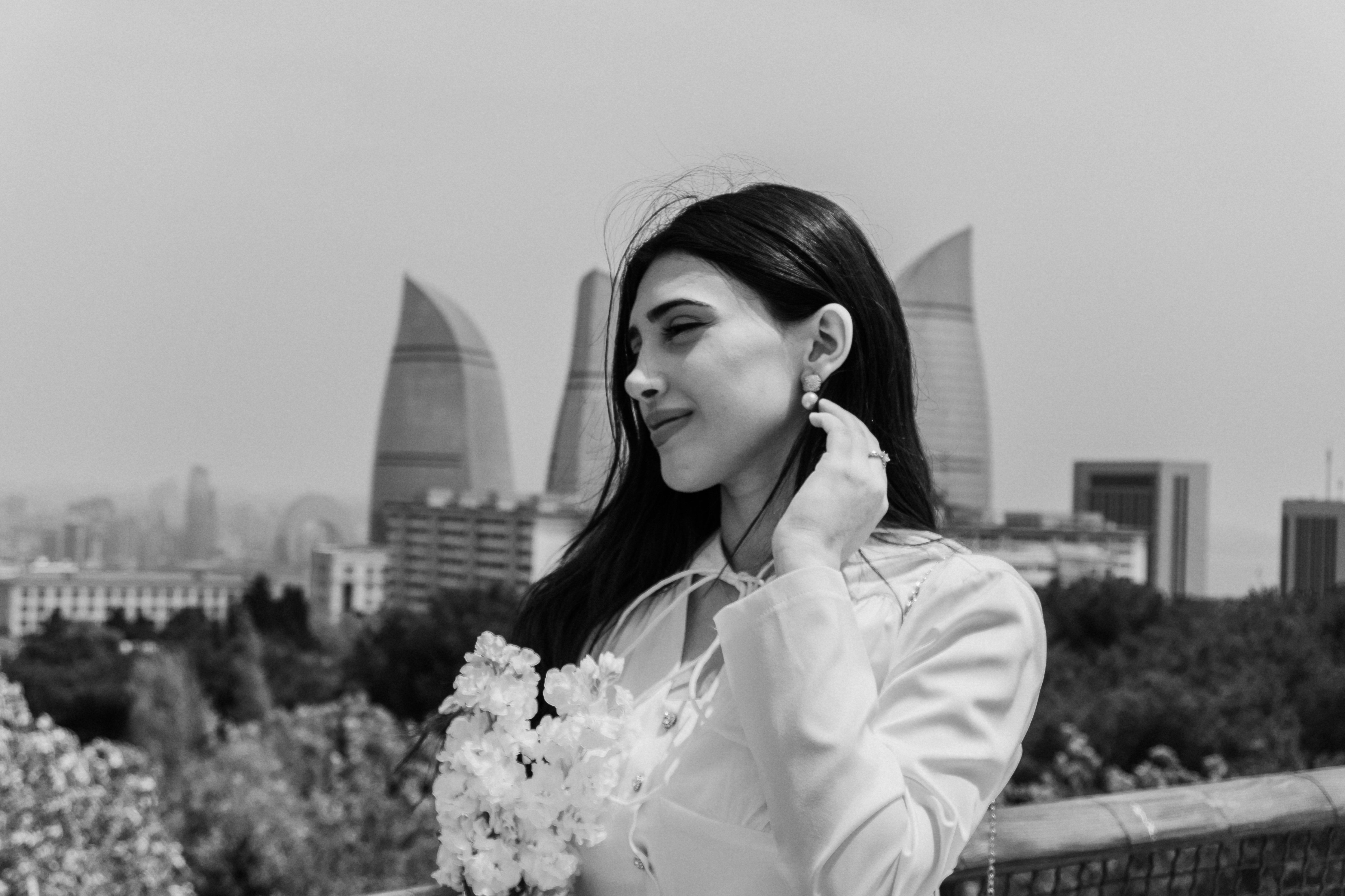 Portrait on the City Edge: Calm Confidence with Urban Silhouettes