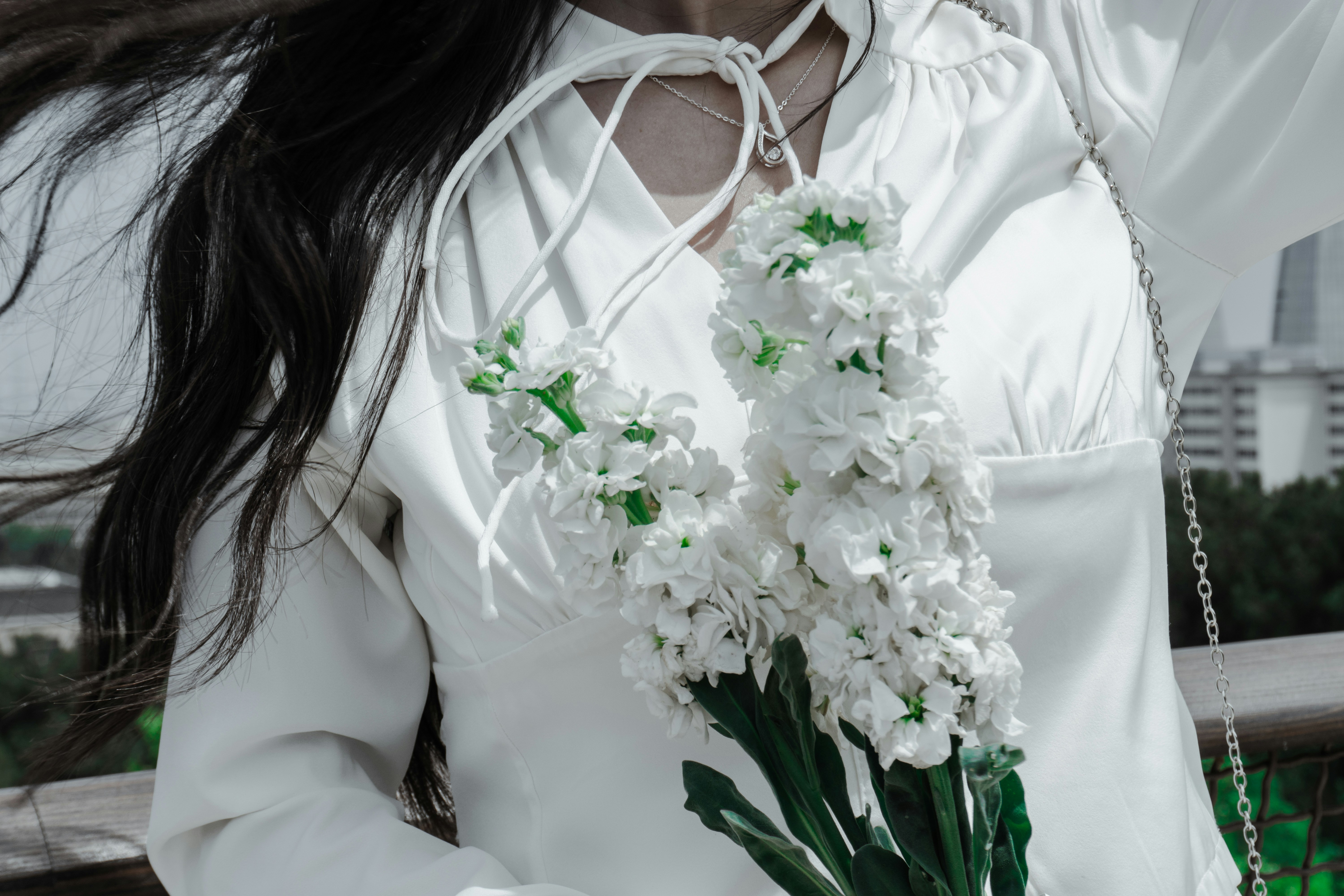 White Bouquet, Dark Hair, and a Striped Quiet Keyhole