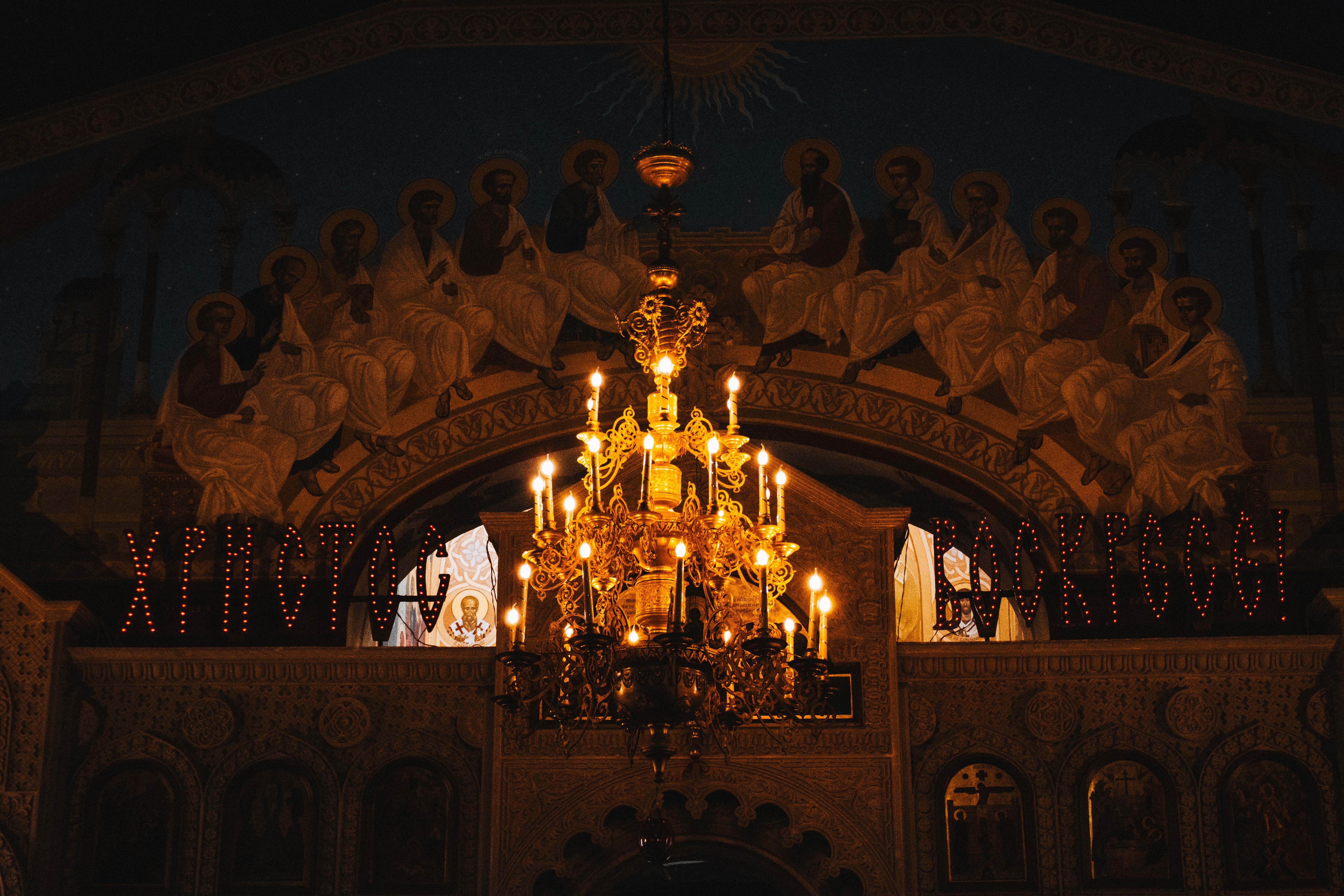 Golden Chandelier Brilliance Above Dim Vaults