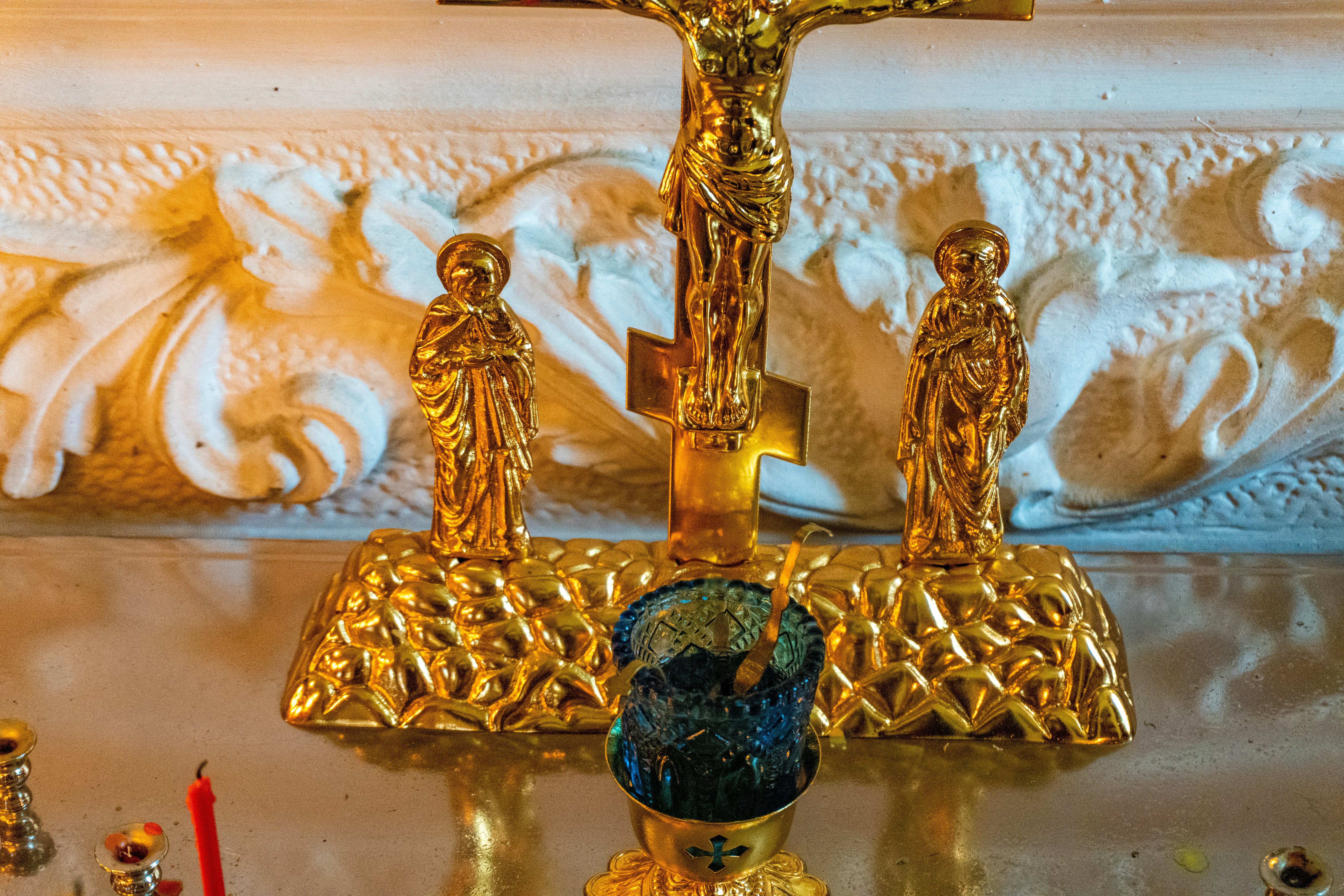 Golden Trinity Altar with Central Crucifix and Candlesticks