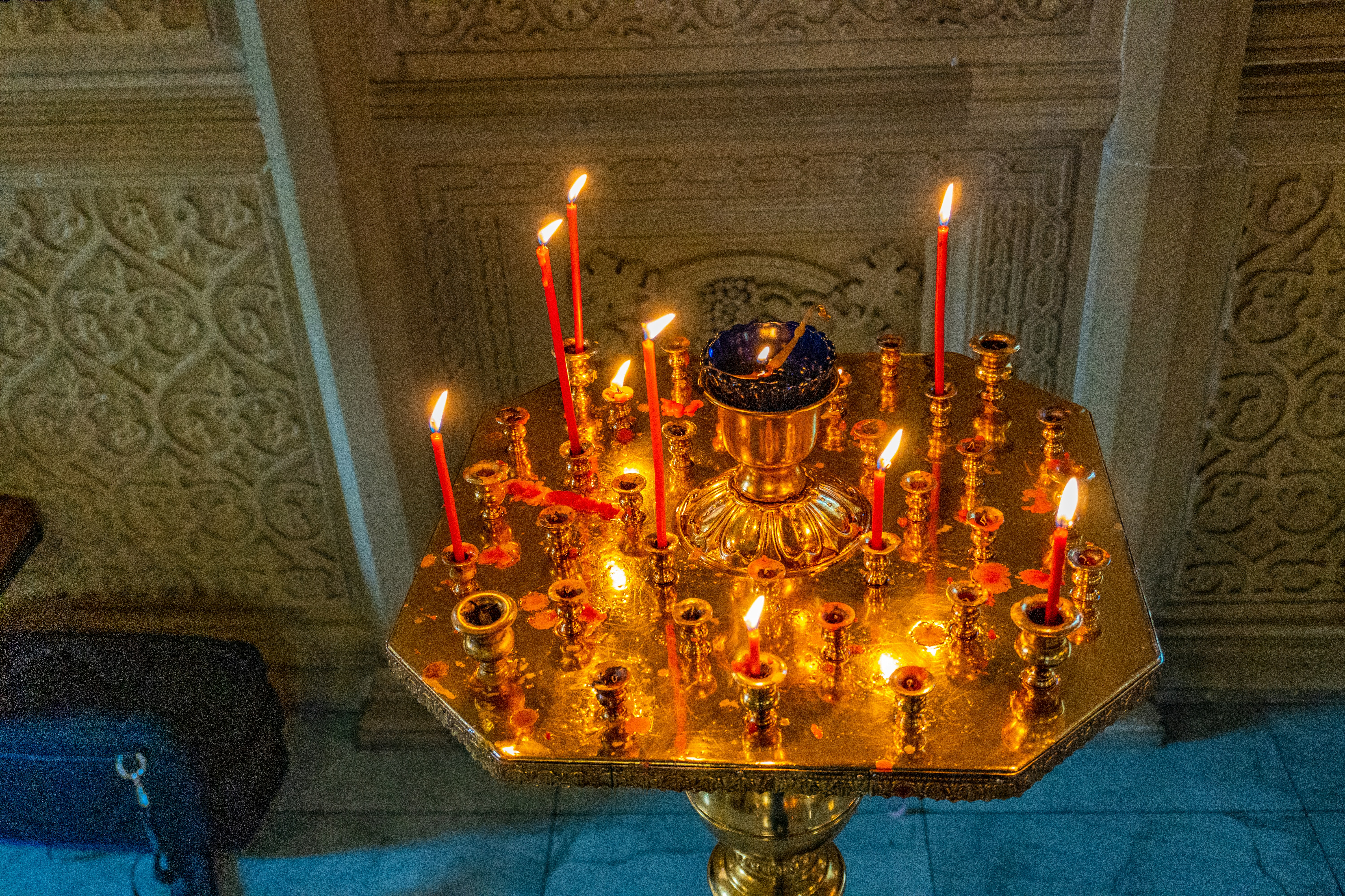Golden Candles on an Ornate Altar: Ritual Light in a Sacred Niche