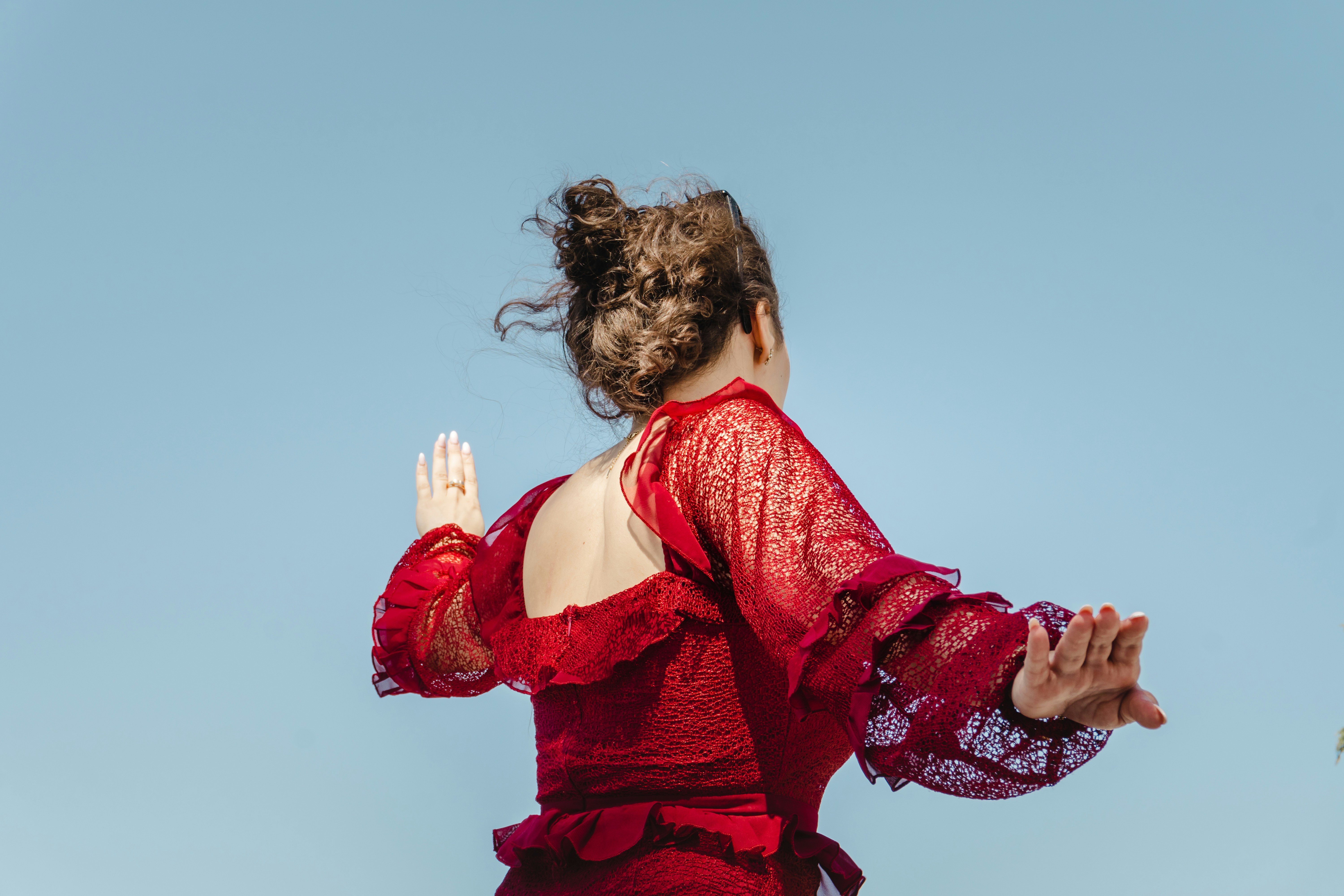 Crimson Dancer in a Clear Sky