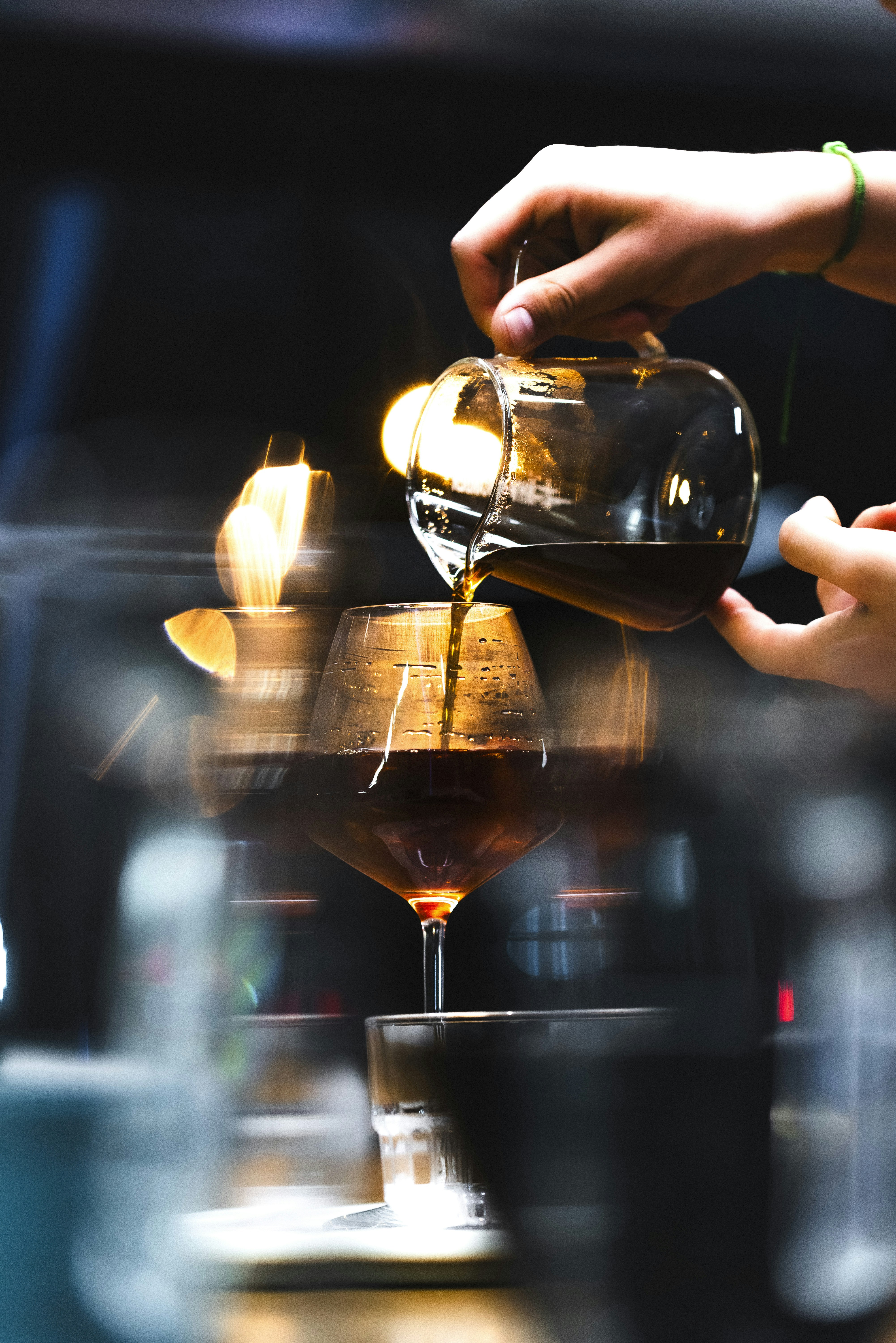 Liquid Gold: Pouring Amber into a Glass of Fire