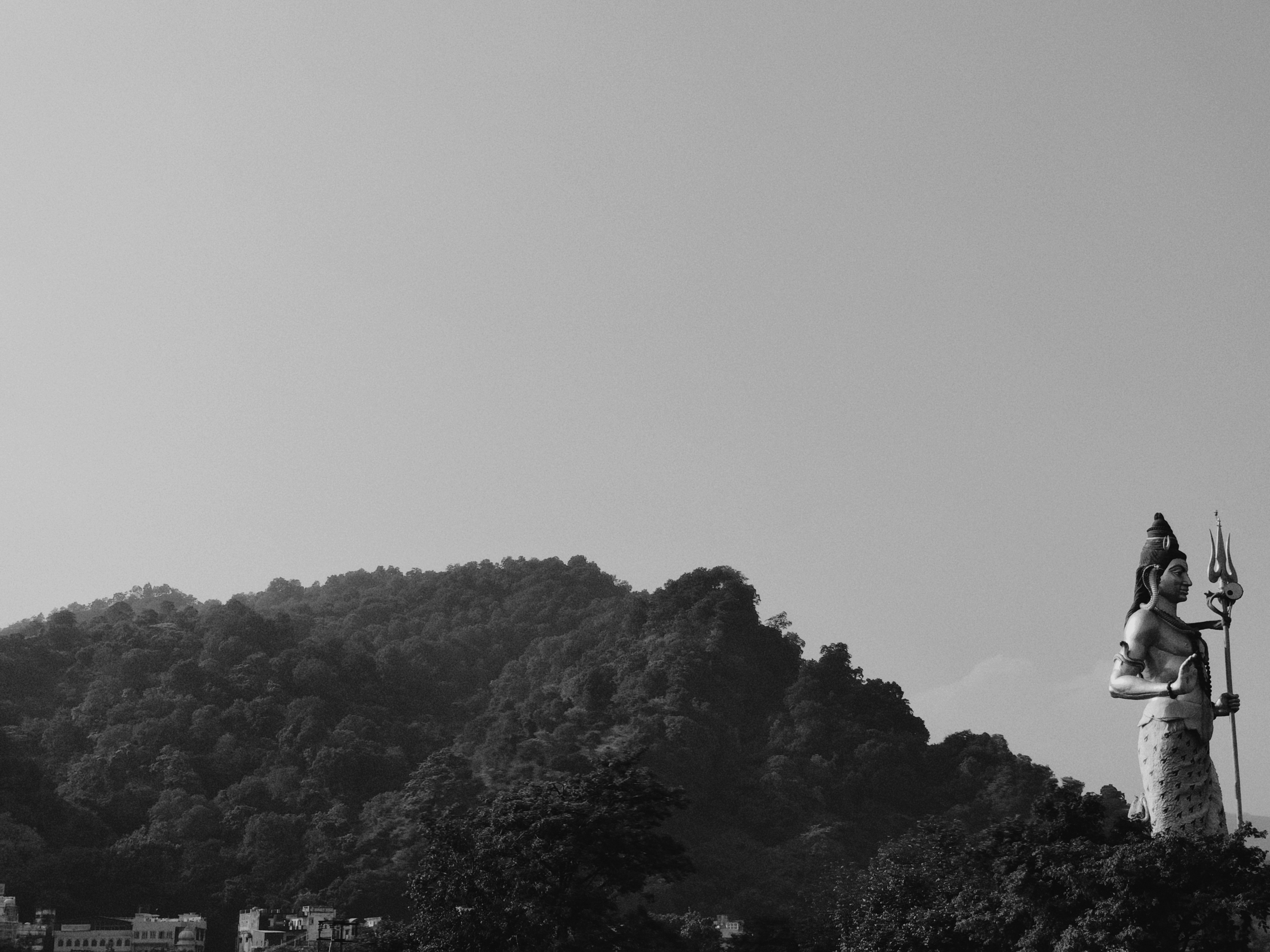 Silent Guardian: A Lone Statue Oversees the Valley