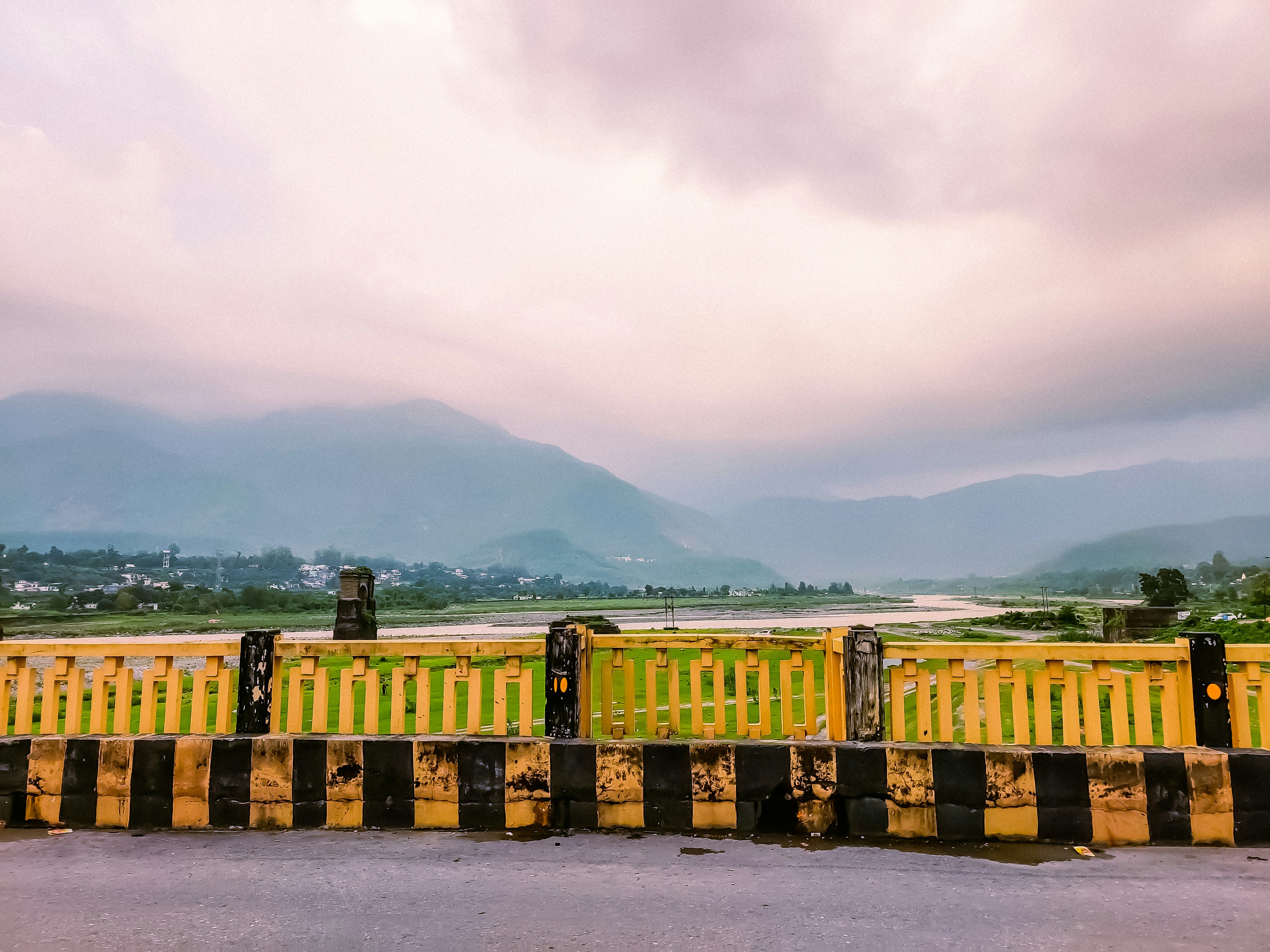 River Valley Overlook: Concrete Barrier with Distant Mountains