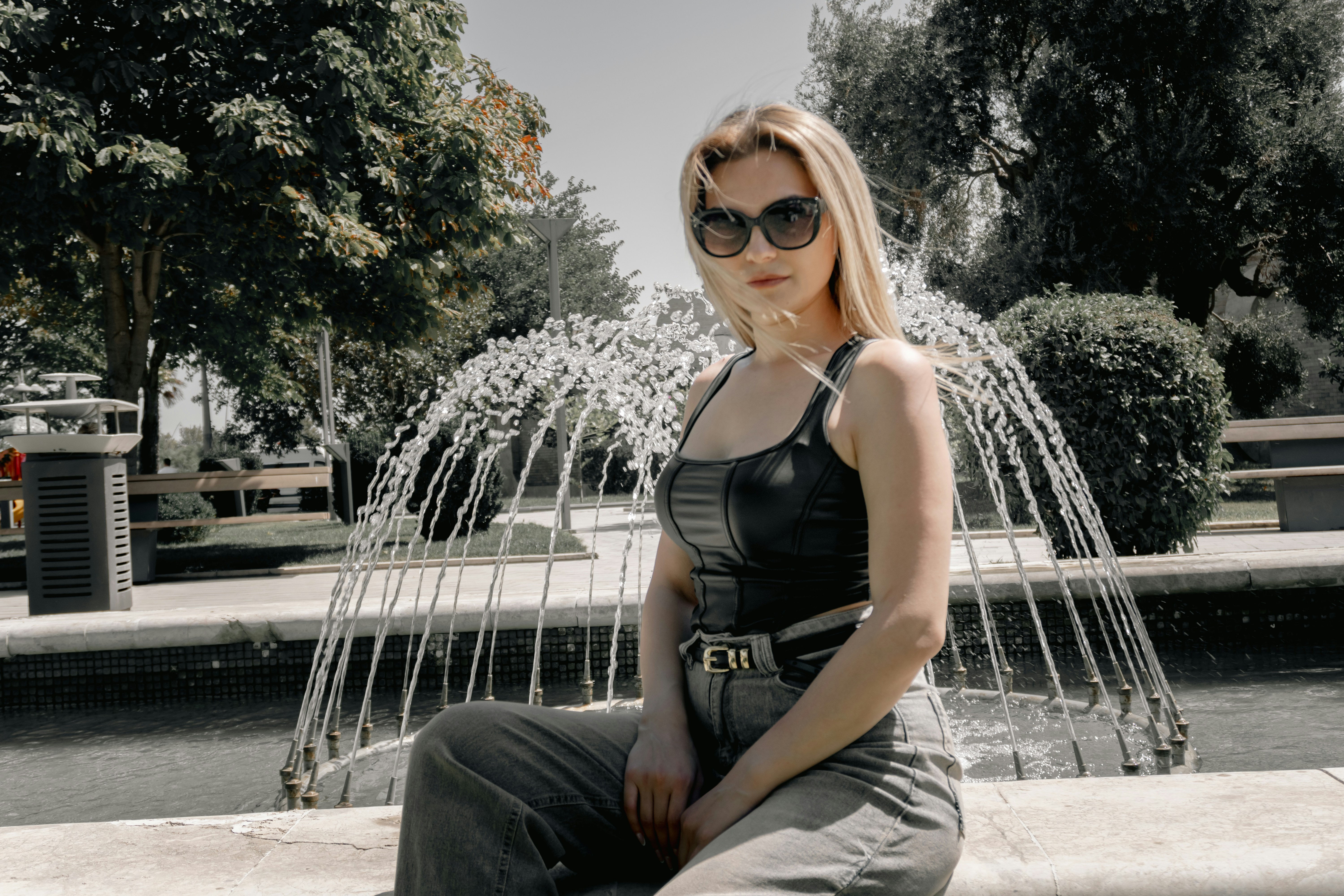 Sunlit Style: a confident portrait by the fountain
