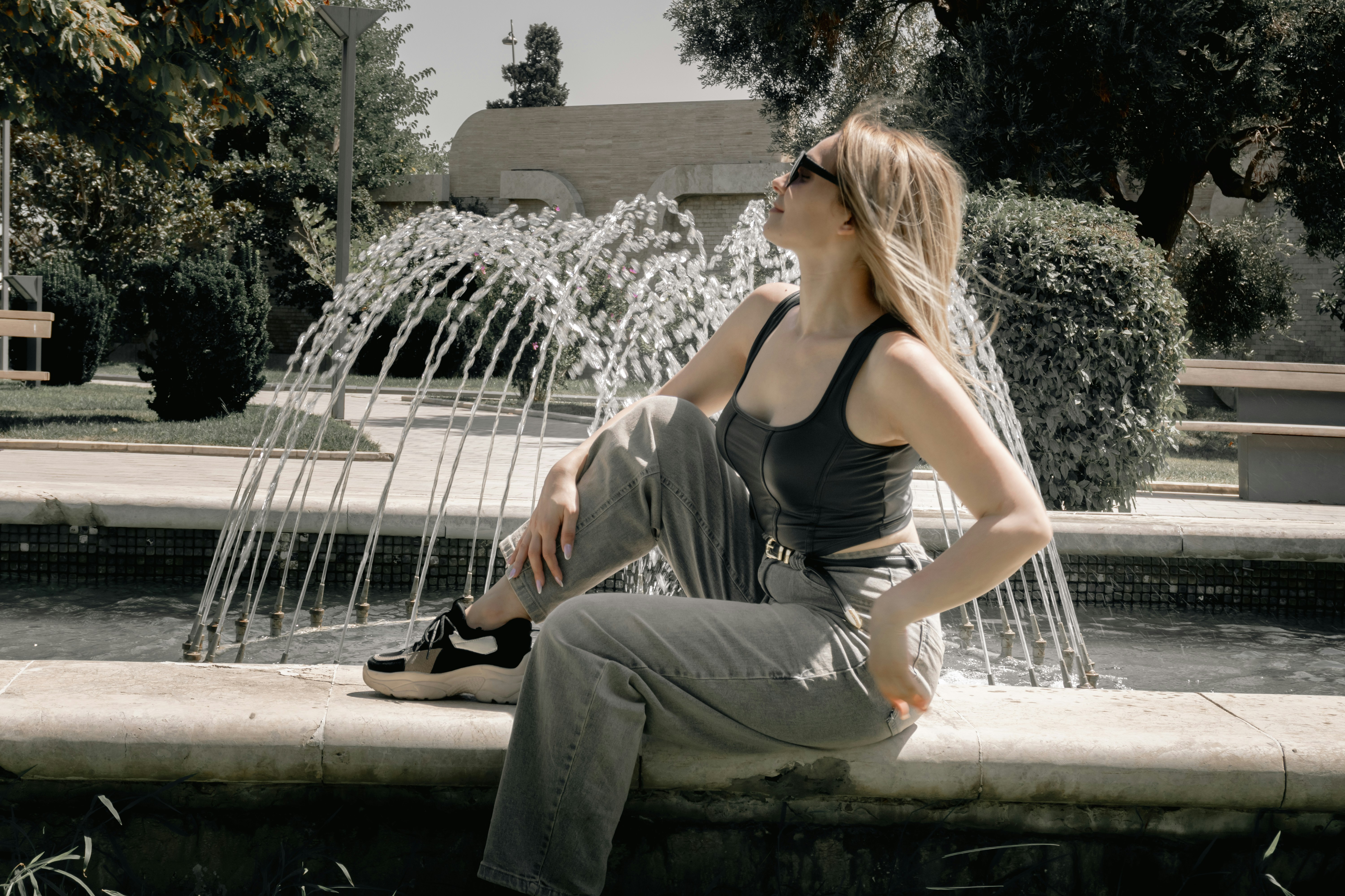 Solemn Recline by the Fountain: A Portrait in Quiet Light