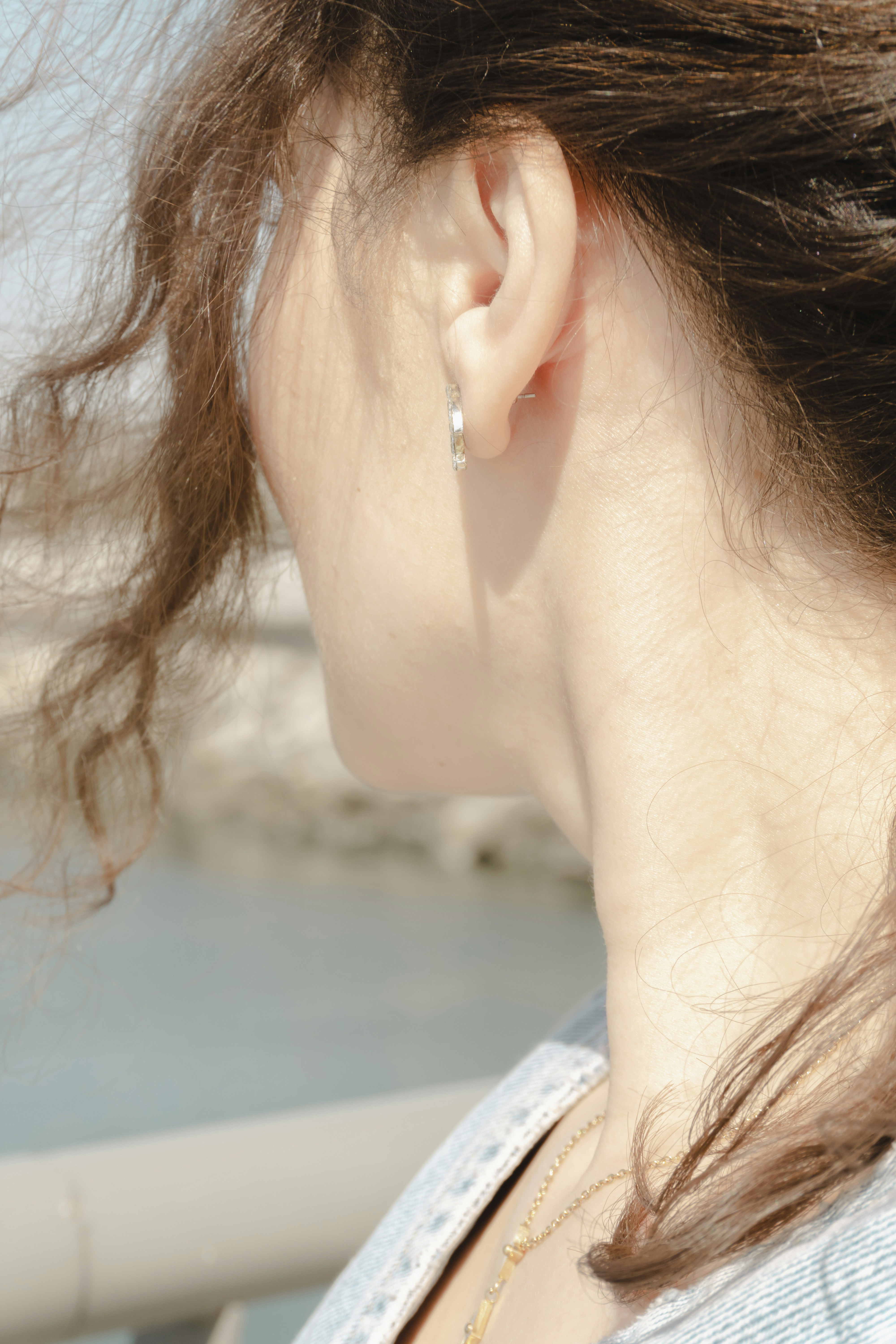 Soft Sunlit Profile: The Ear and Neck in Focus