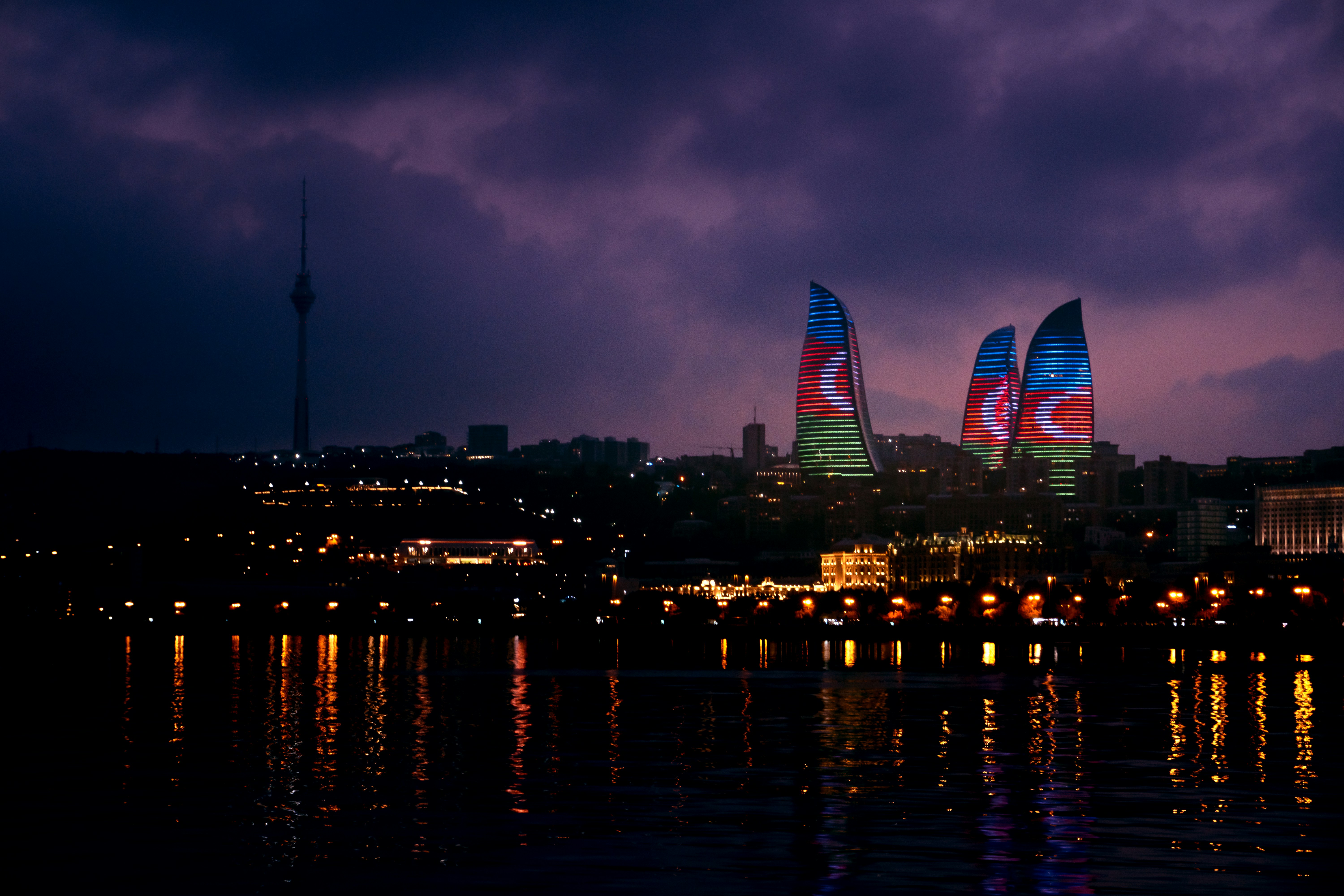 Neon Skyline Reflections: Nightscape Over the Waterfront