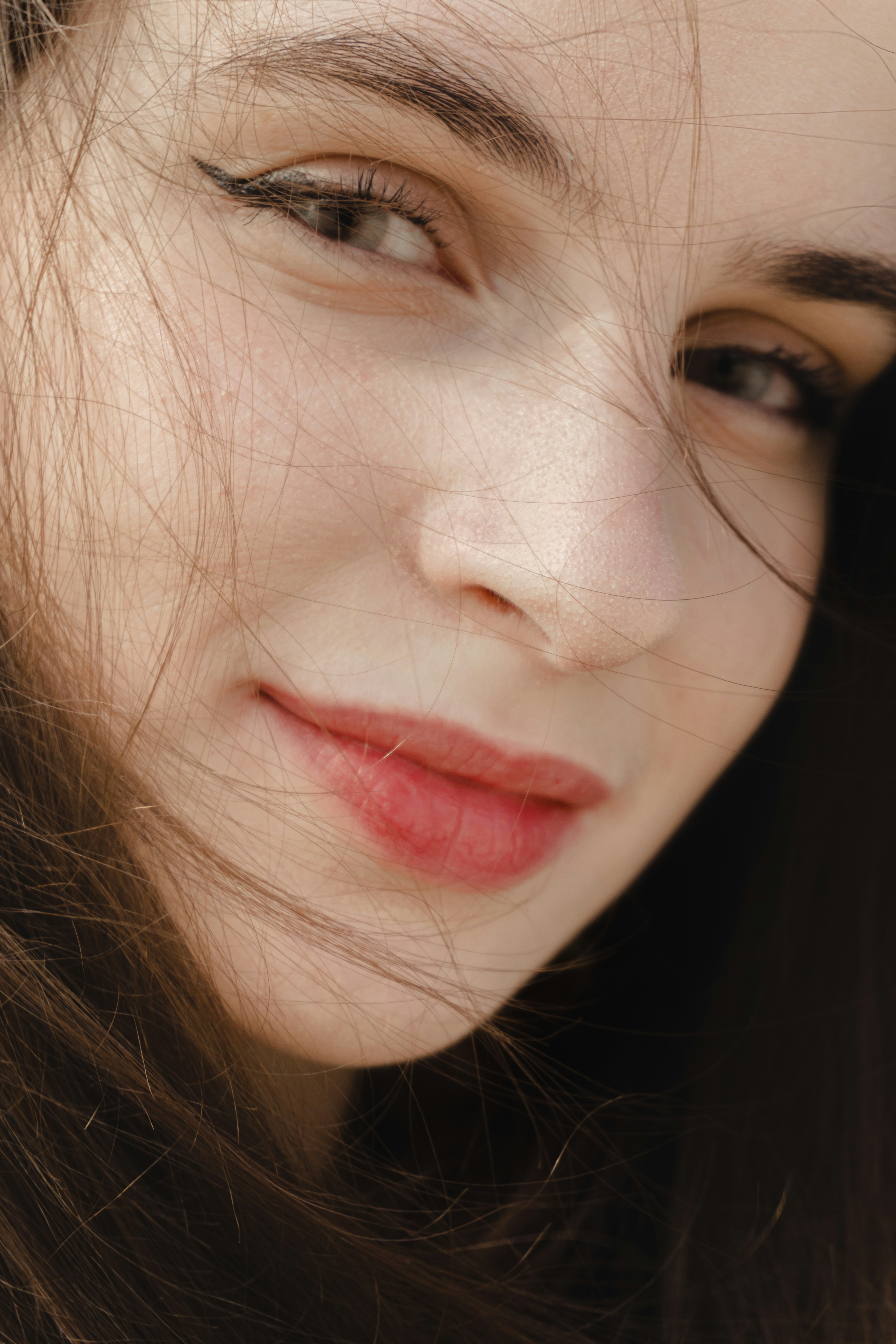 Close-Up of a Soft-Faced Portrait with Wind-Swept Hair