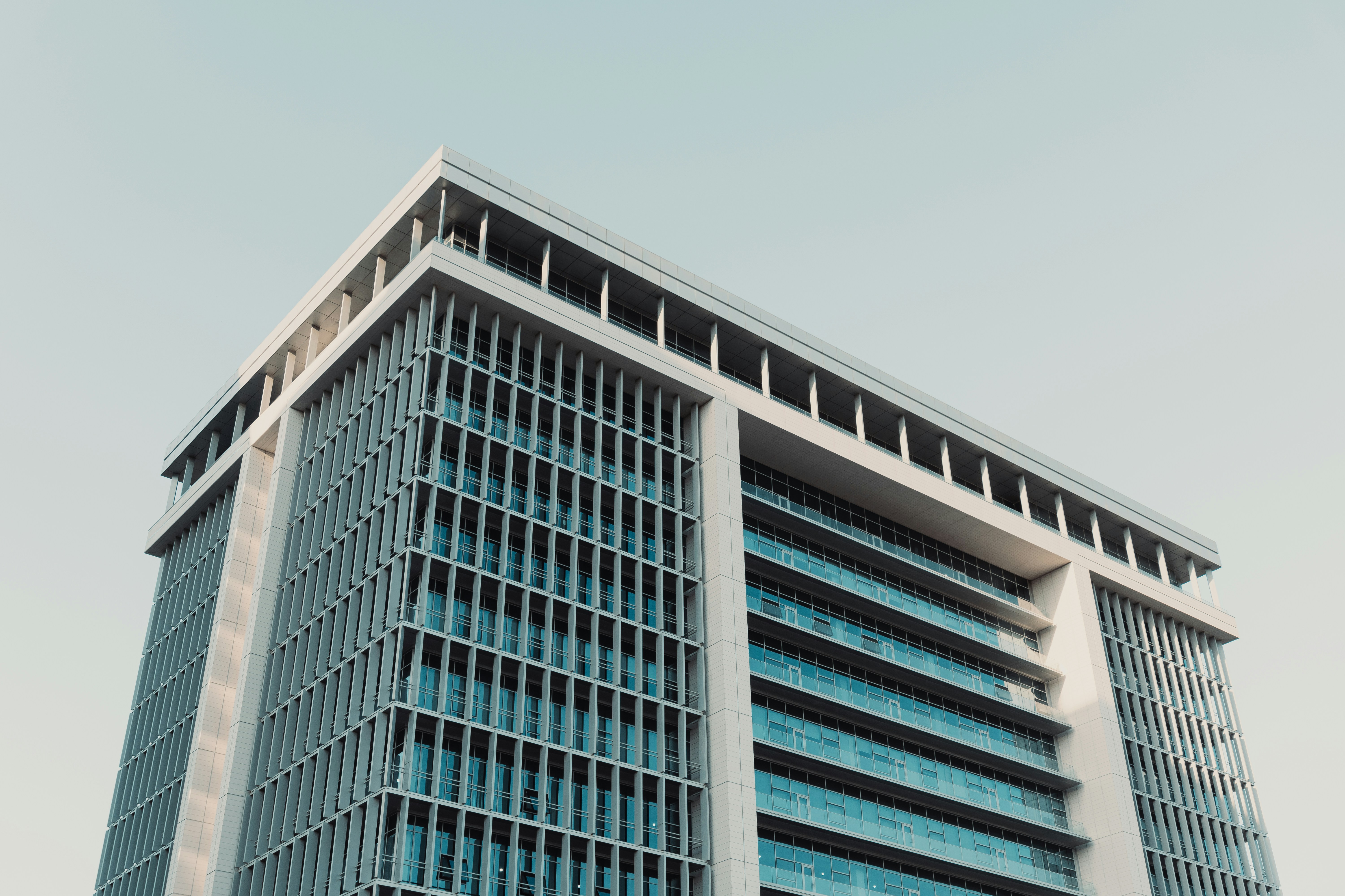 Chevron of Glass: A Cornered Tower Reaching into a Clear Sky